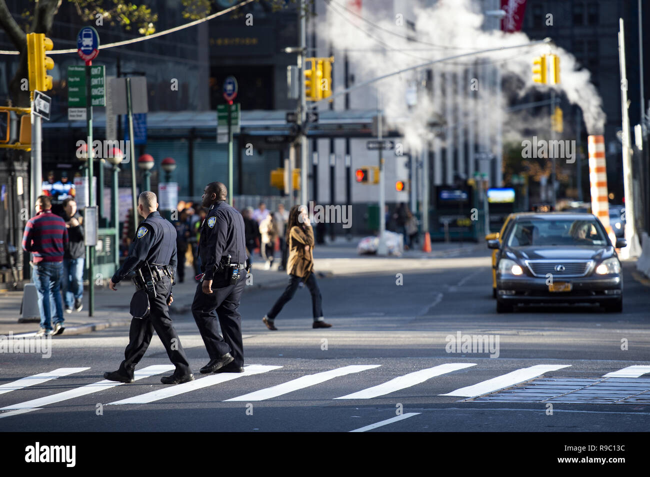 Two police in background hi-res stock photography and images - Alamy