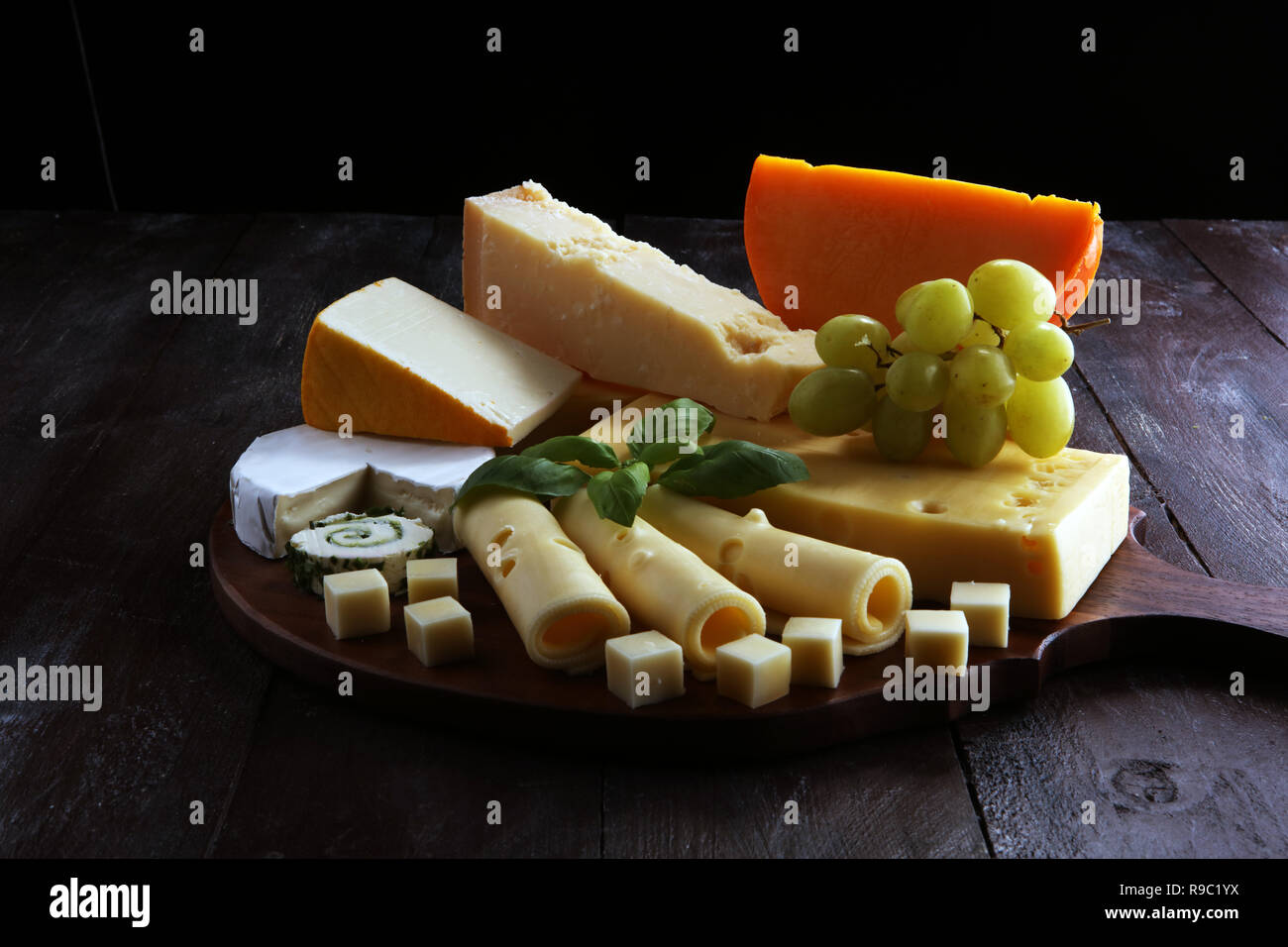 Cheese plate served with grapes, various cheese on a platter Stock ...
