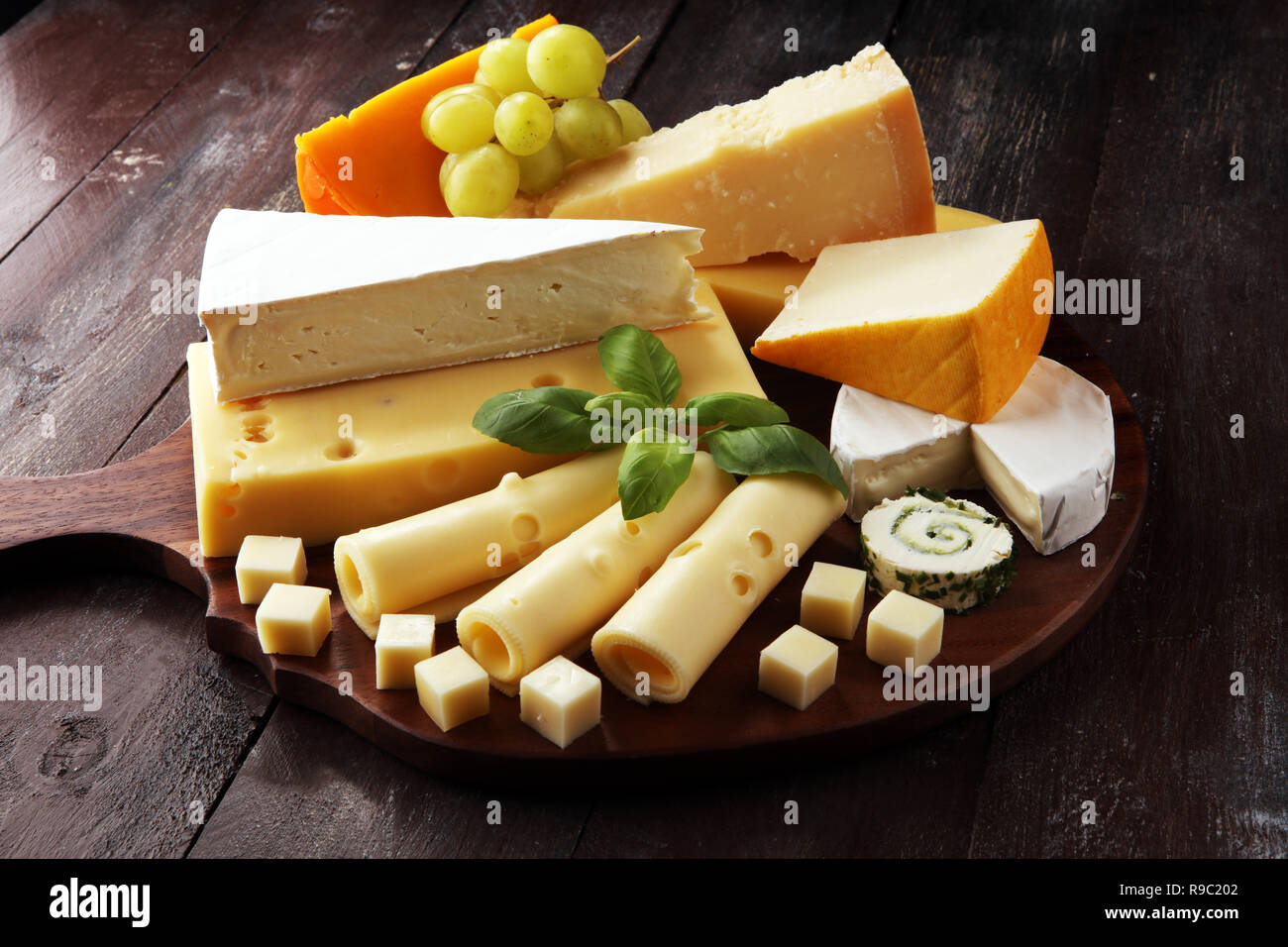 Cheese plate served with grapes, various cheese on a platter Stock ...