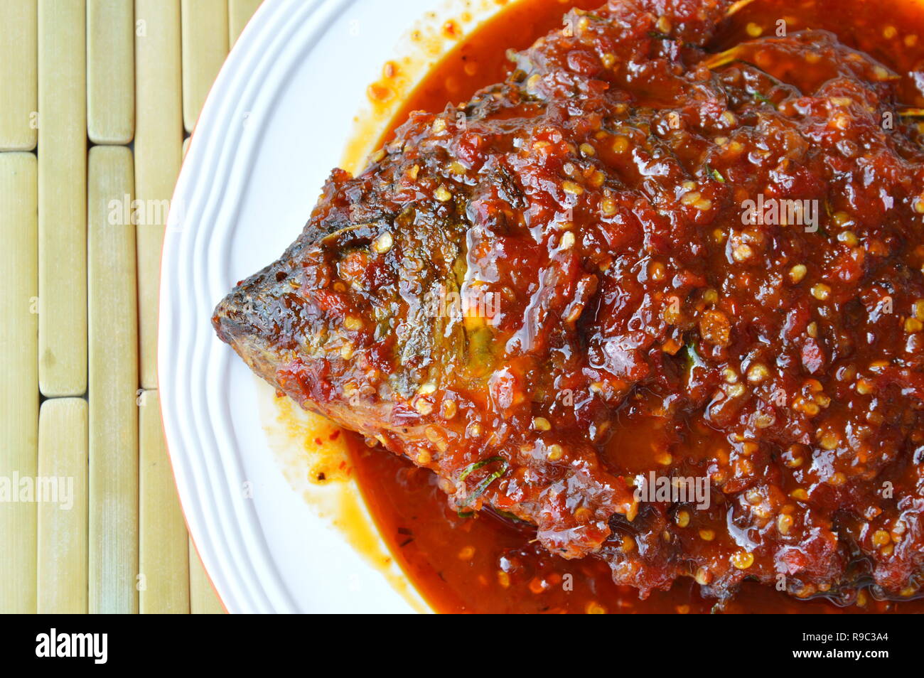 deep fried black mango fish dressing chili sauce on plate Stock Photo ...