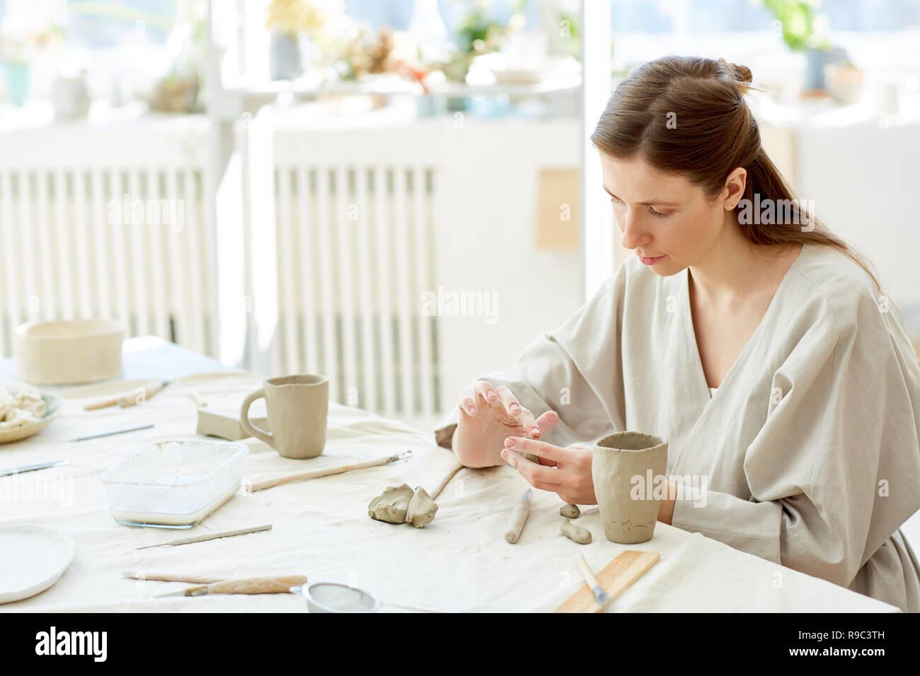 Making ceramic mugs Stock Photo - Alamy