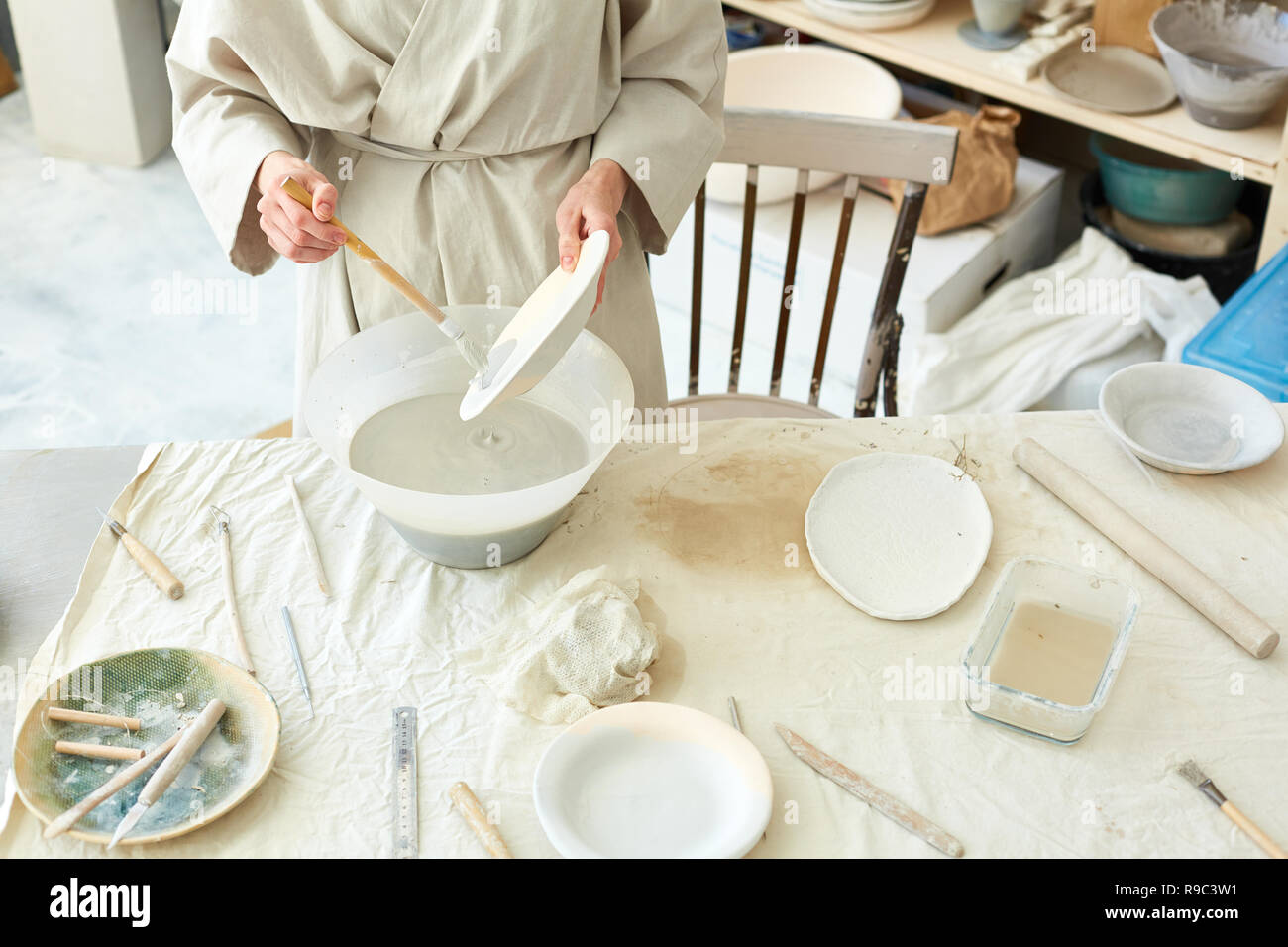 Making clay mixture Stock Photo - Alamy