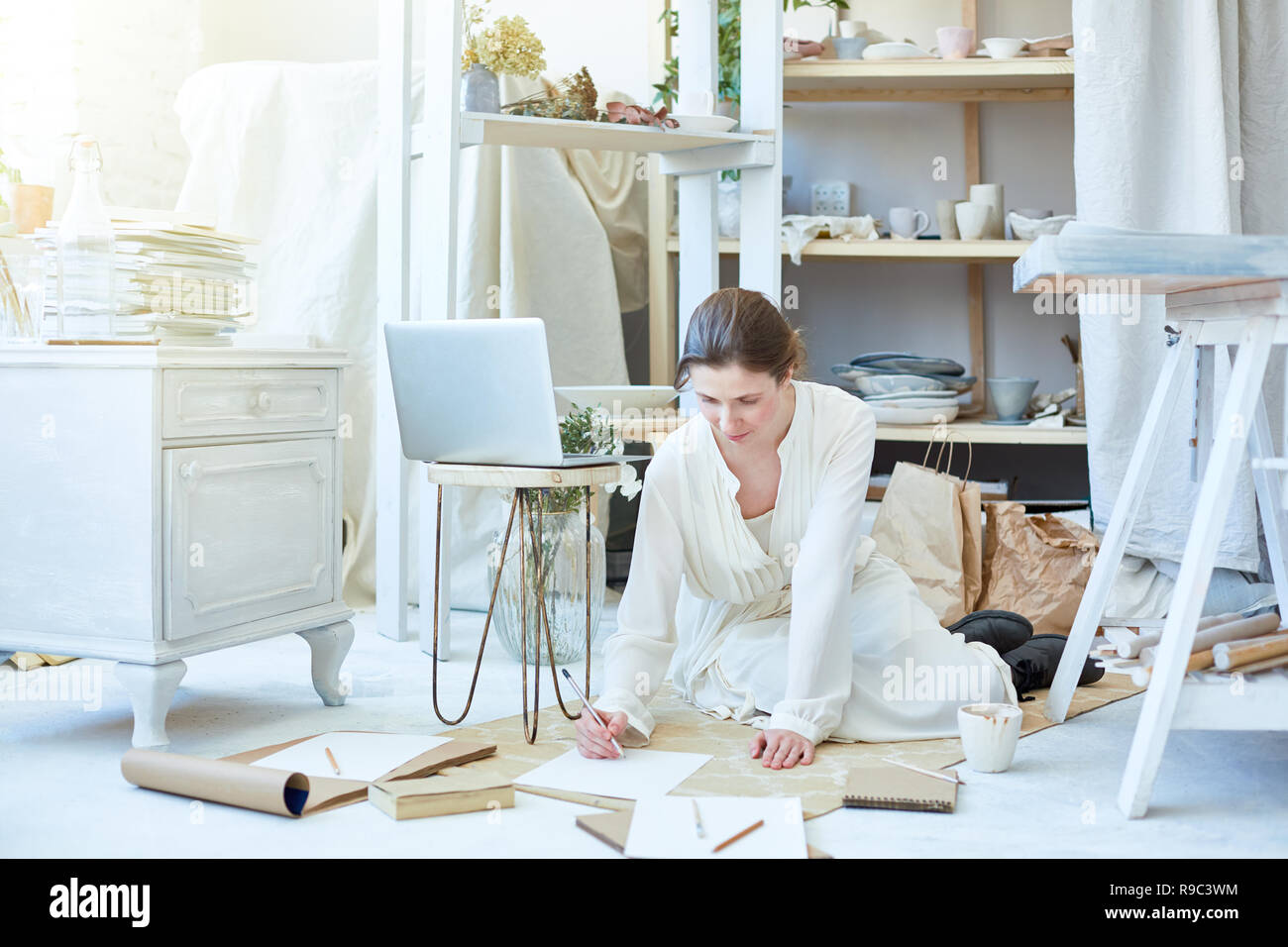 Woman sketching in studio Stock Photo - Alamy
