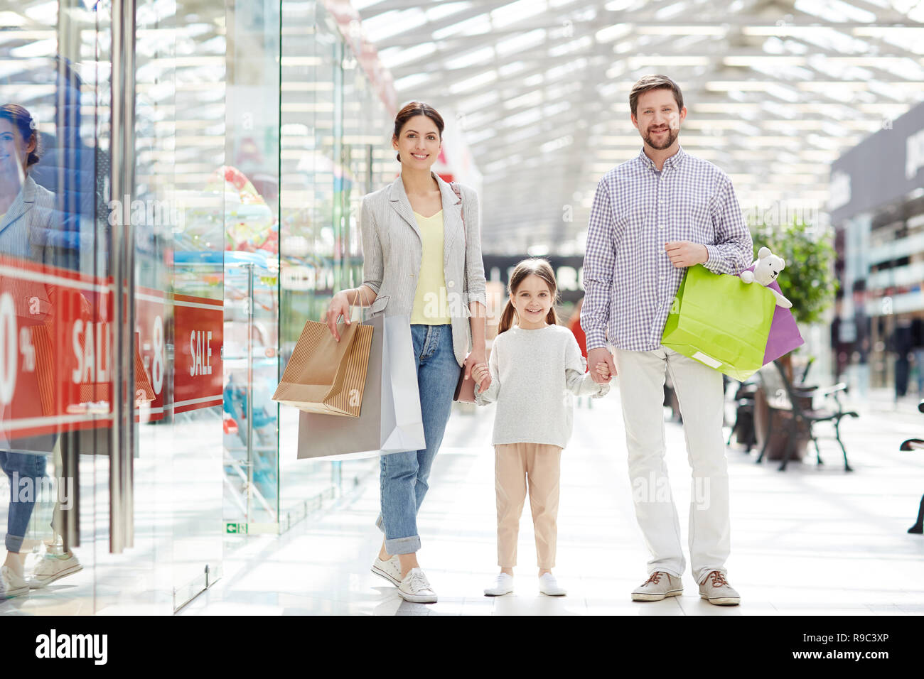 Shopping with parents Stock Photo - Alamy