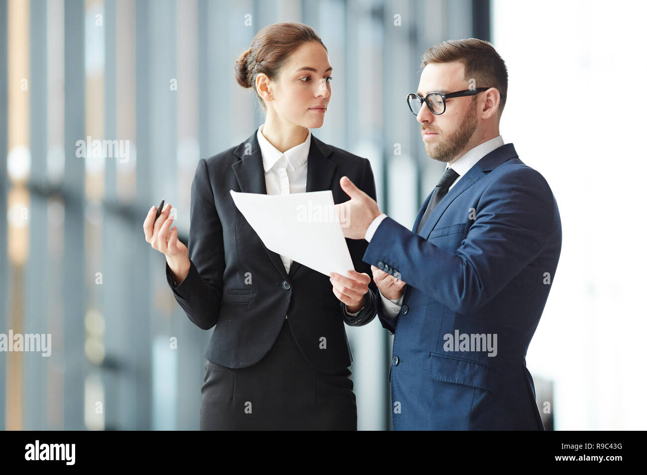 Discussing points of report Stock Photo - Alamy