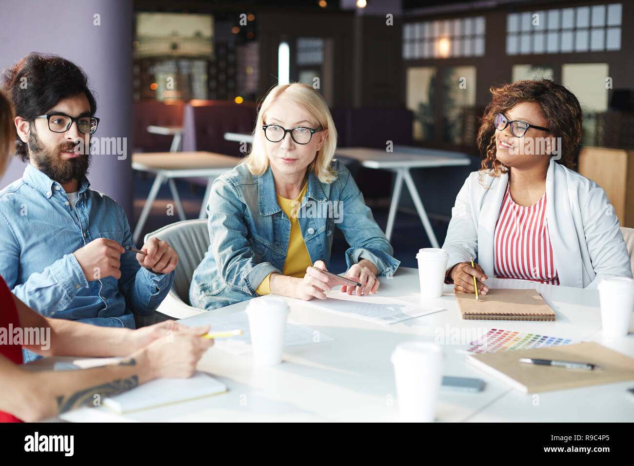 Group of creative designers at meeting Stock Photo - Alamy