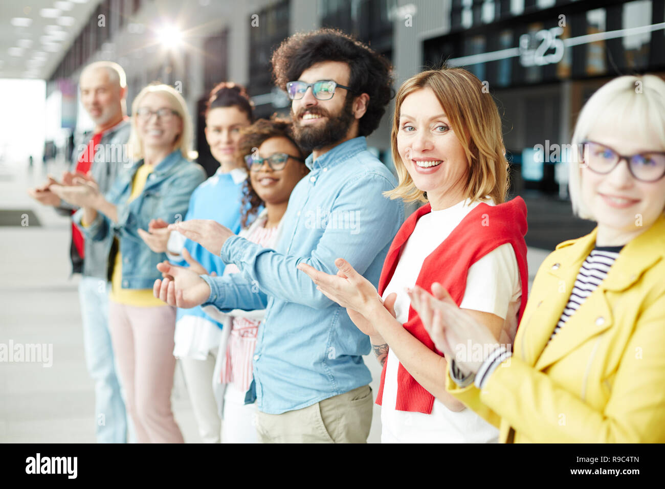 Successful people clapping hands in line Stock Photo - Alamy