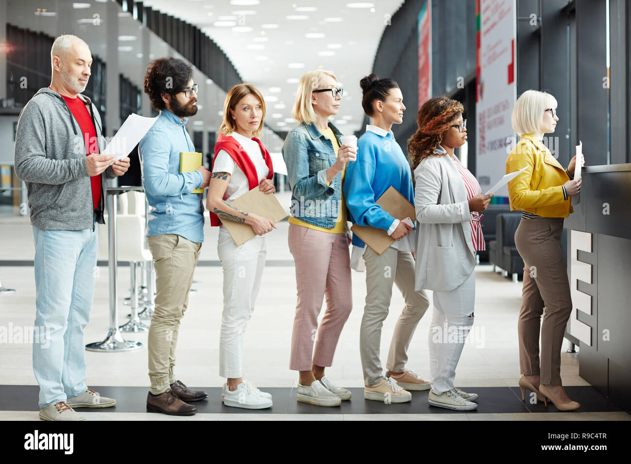 Standing in line for long time Stock Photo - Alamy