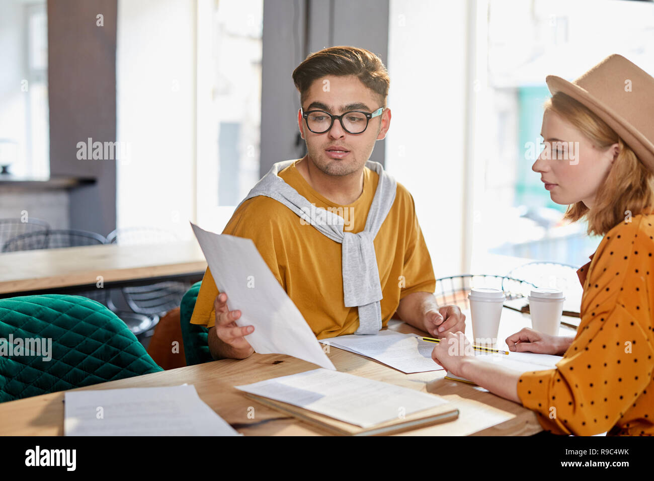 Young employee reading contract hi-res stock photography and images - Alamy