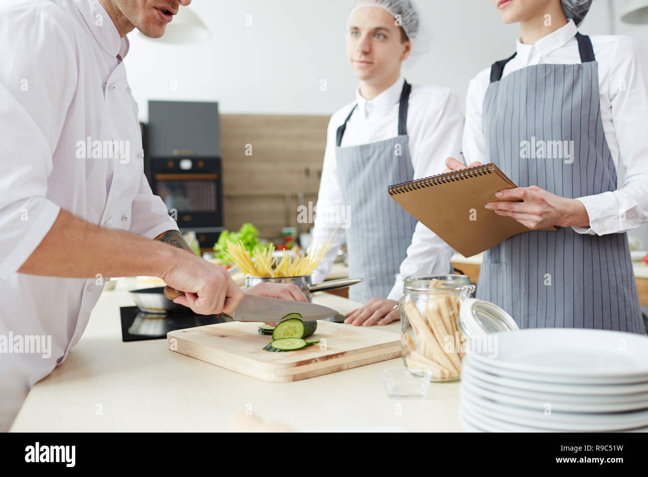 Cooking and consulting Stock Photo - Alamy