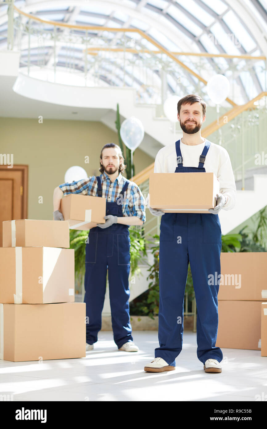 Professional workers helping with moving Stock Photo - Alamy