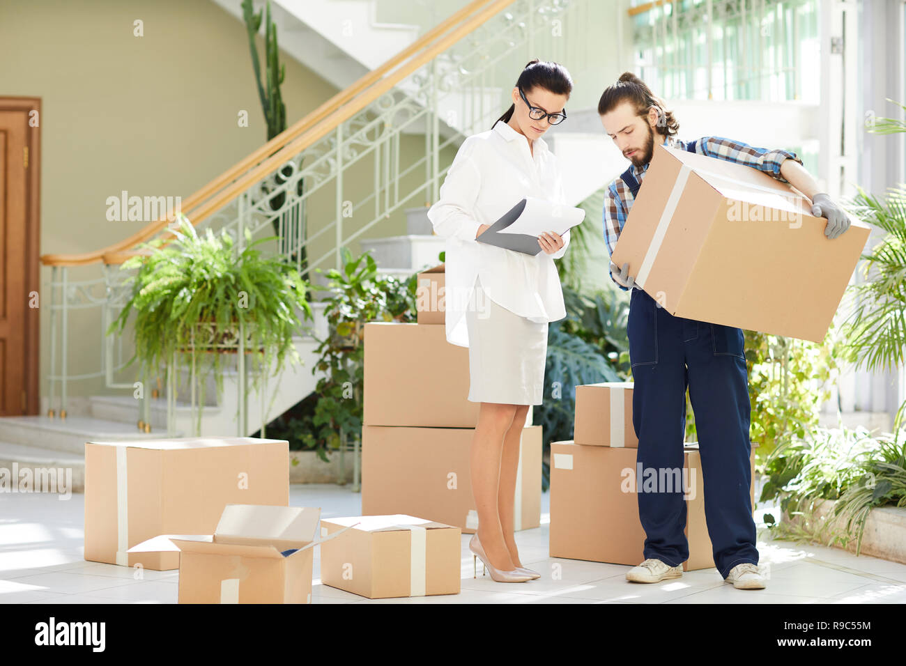 Business lady running moving staff Stock Photo - Alamy