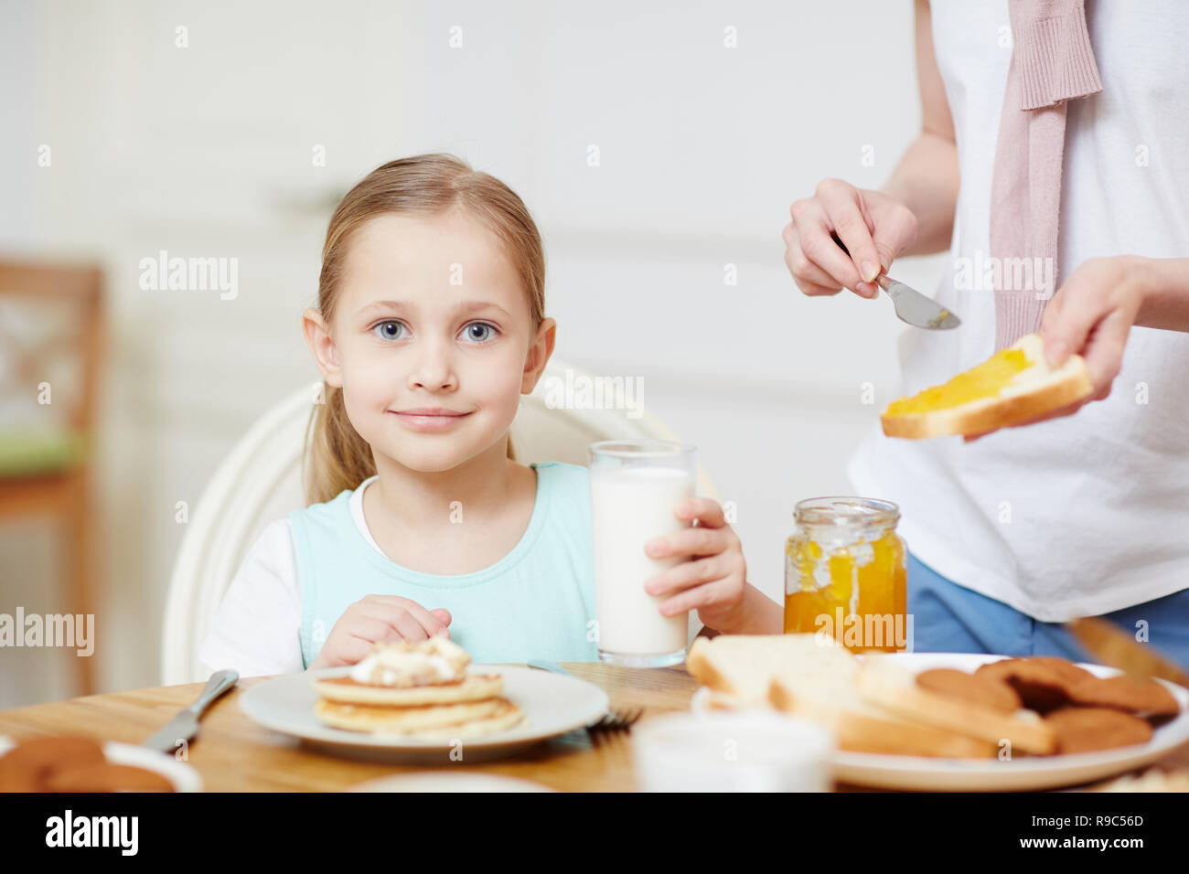 Girl eating toast breakfast hi-res stock photography and images - Alamy