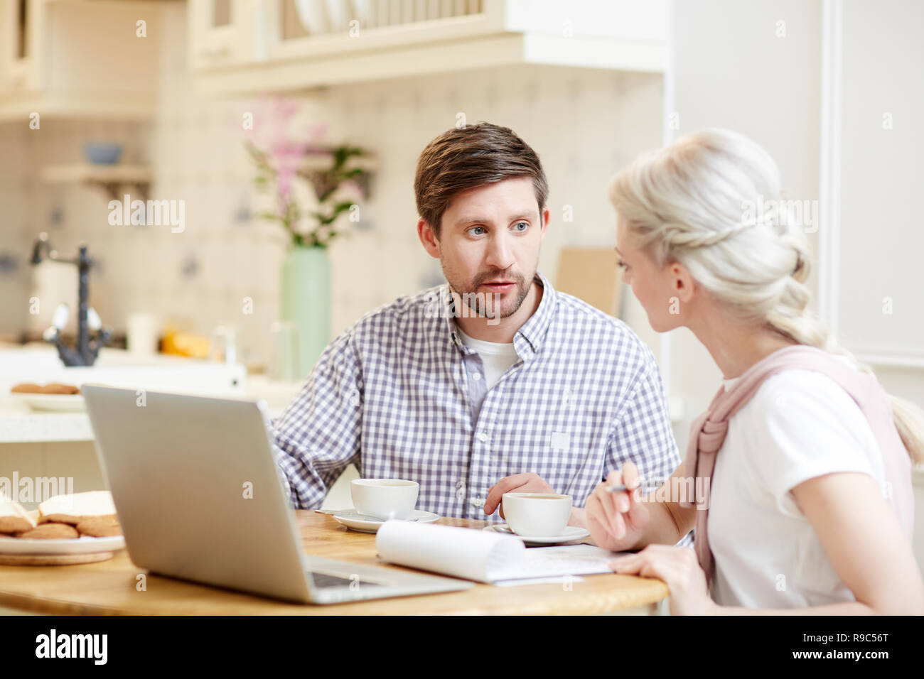 Working in the kitchen Stock Photo - Alamy