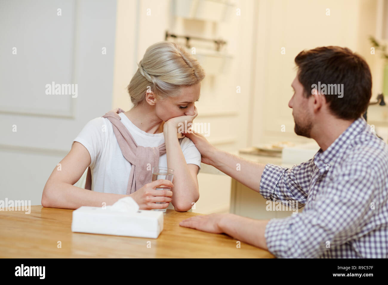 Husband comforting wife hi-res stock photography and images - Alamy