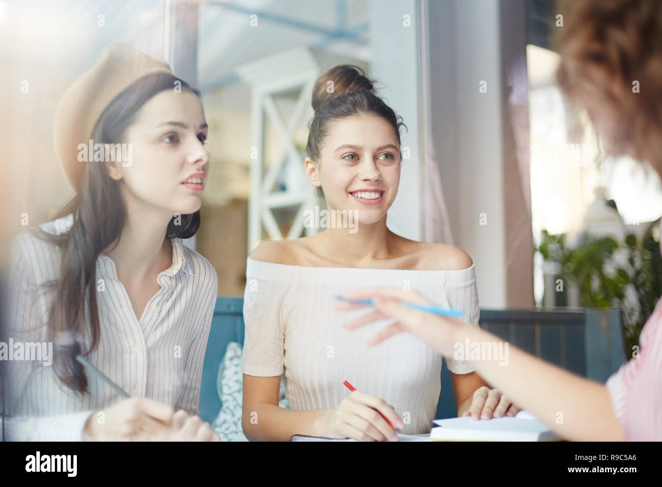 Discussing home assignment Stock Photo - Alamy