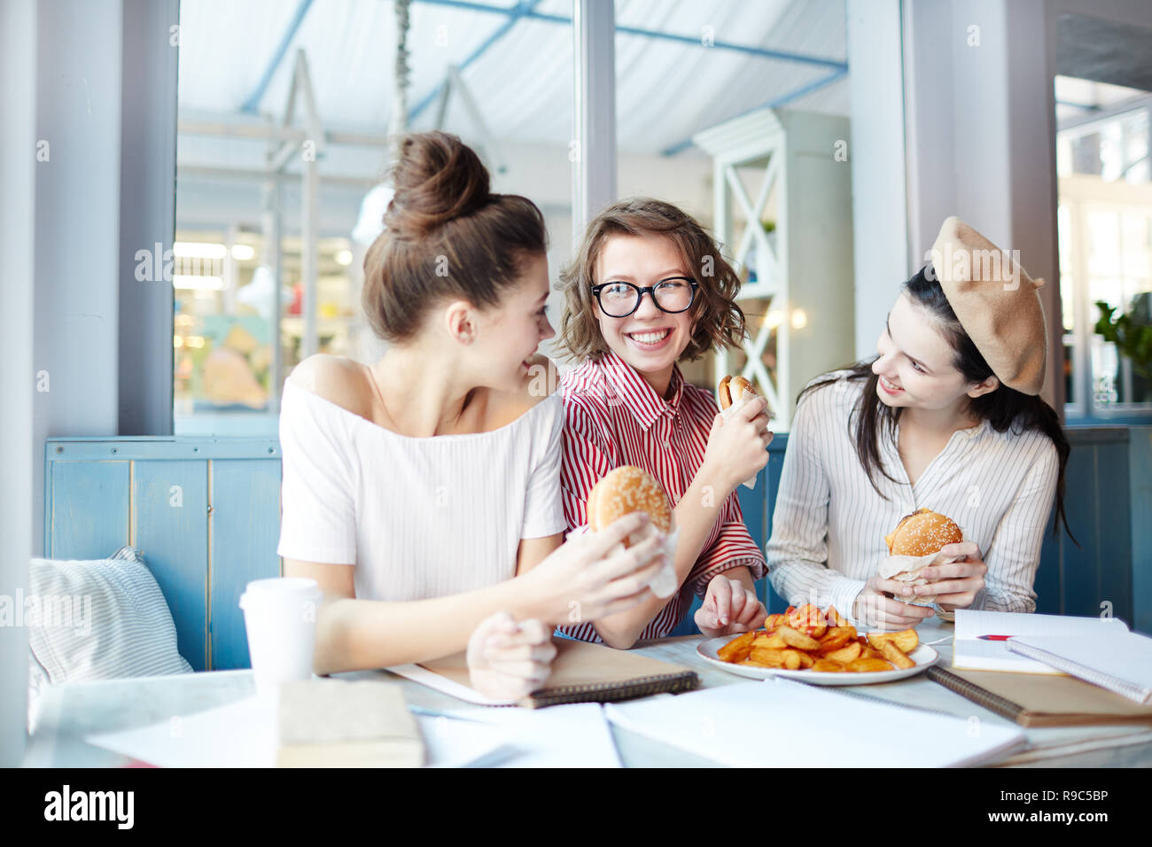 Gathering in cafe Stock Photo - Alamy