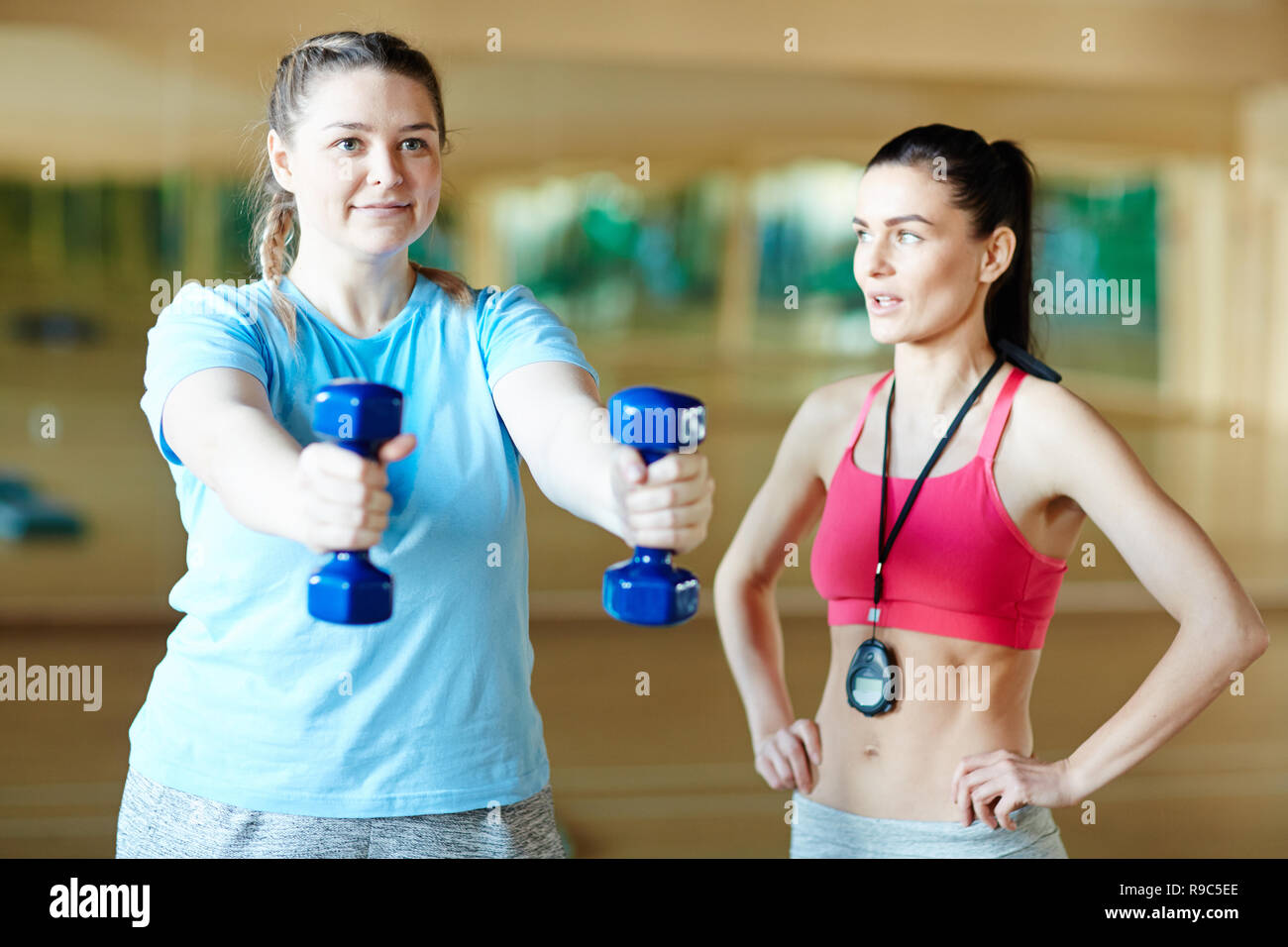Young adult gym coach hi-res stock photography and images - Alamy