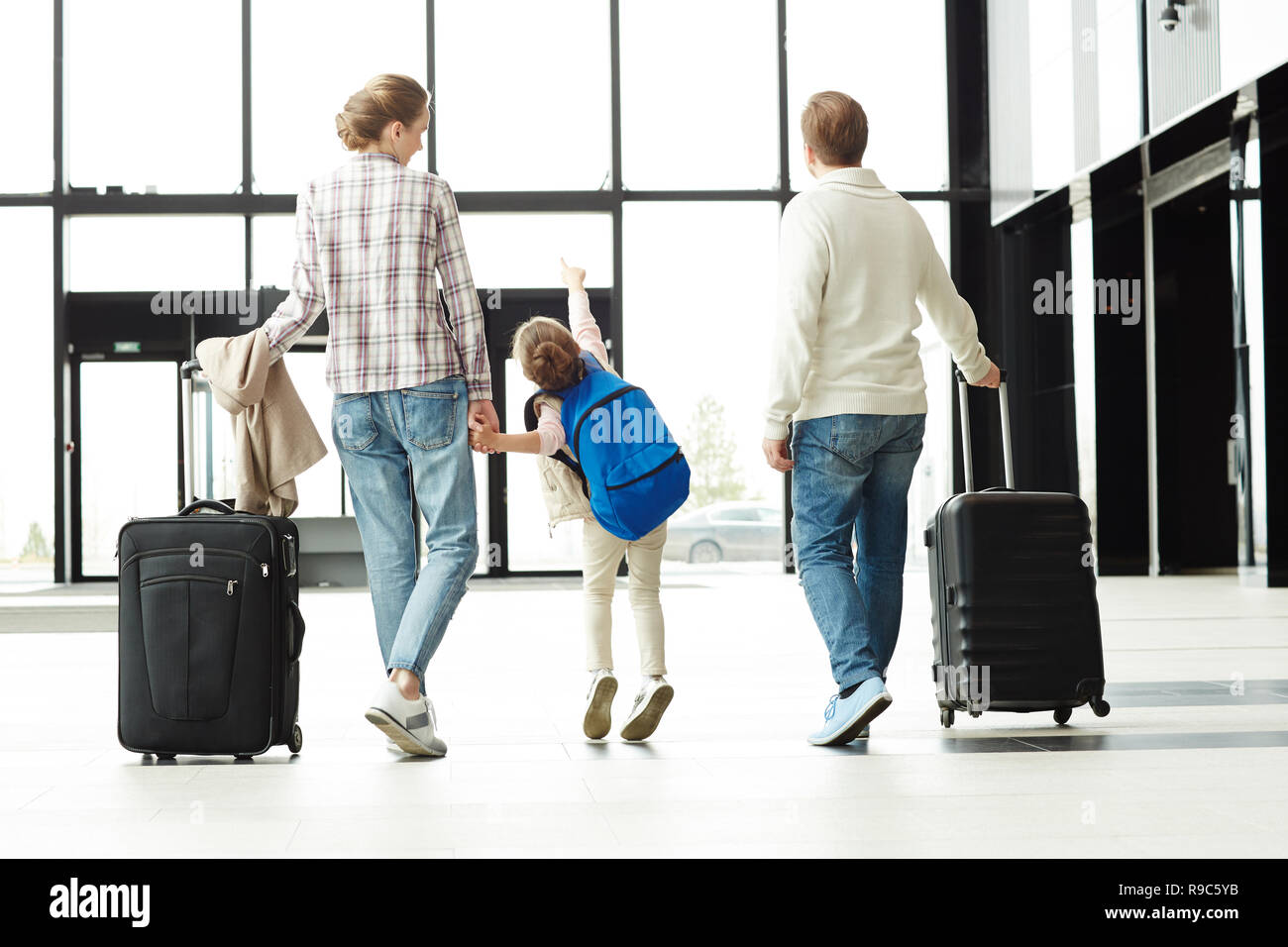 Family on arrival Stock Photo - Alamy