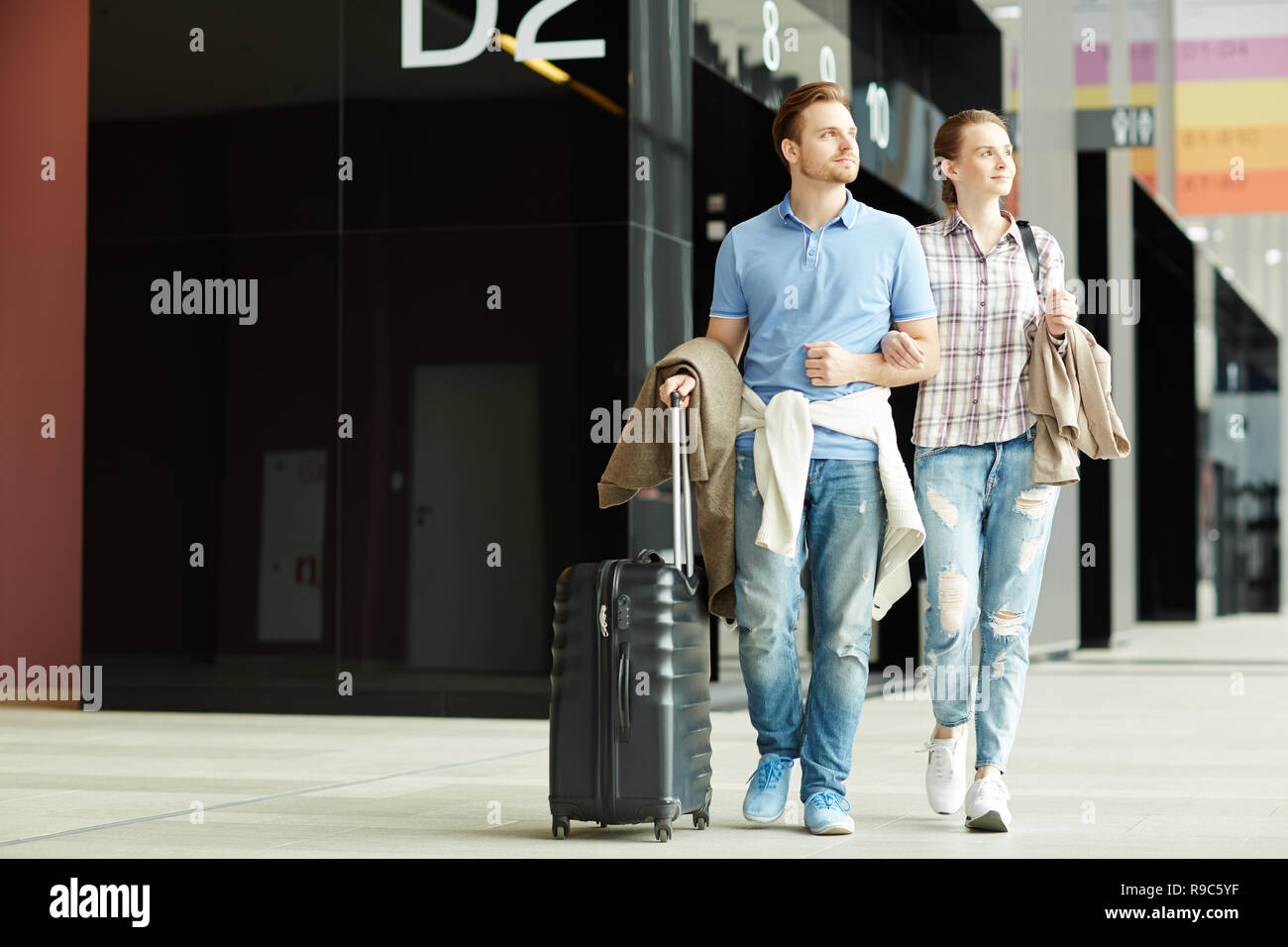 Travelers in airport Stock Photo - Alamy