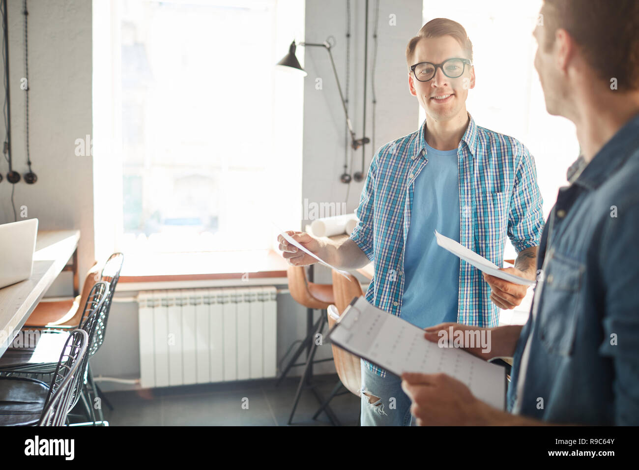 Discussing papers and ideas Stock Photo - Alamy