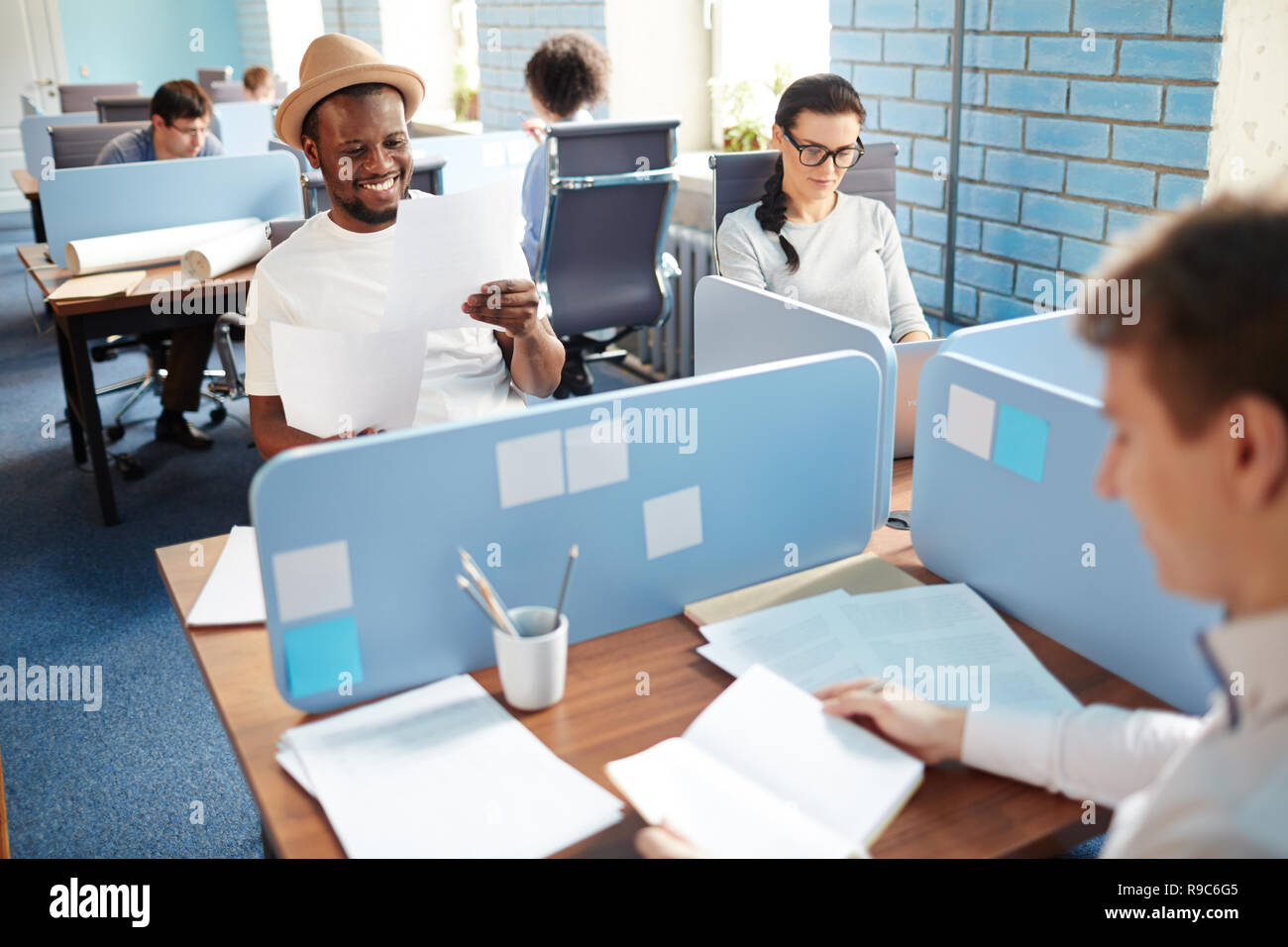 Working in open space office Stock Photo - Alamy