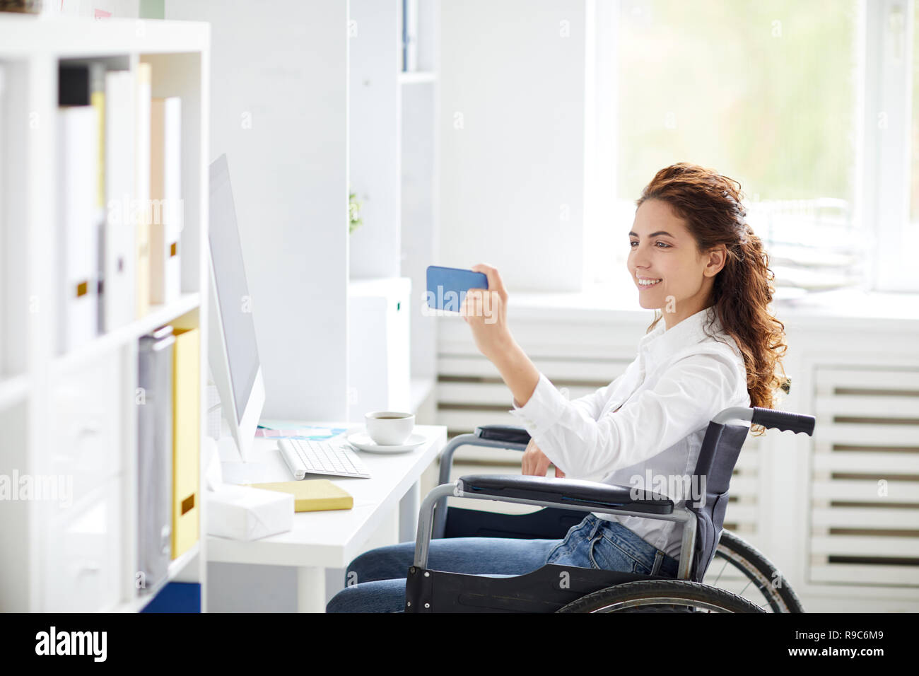 Selfie by workplace Stock Photo - Alamy