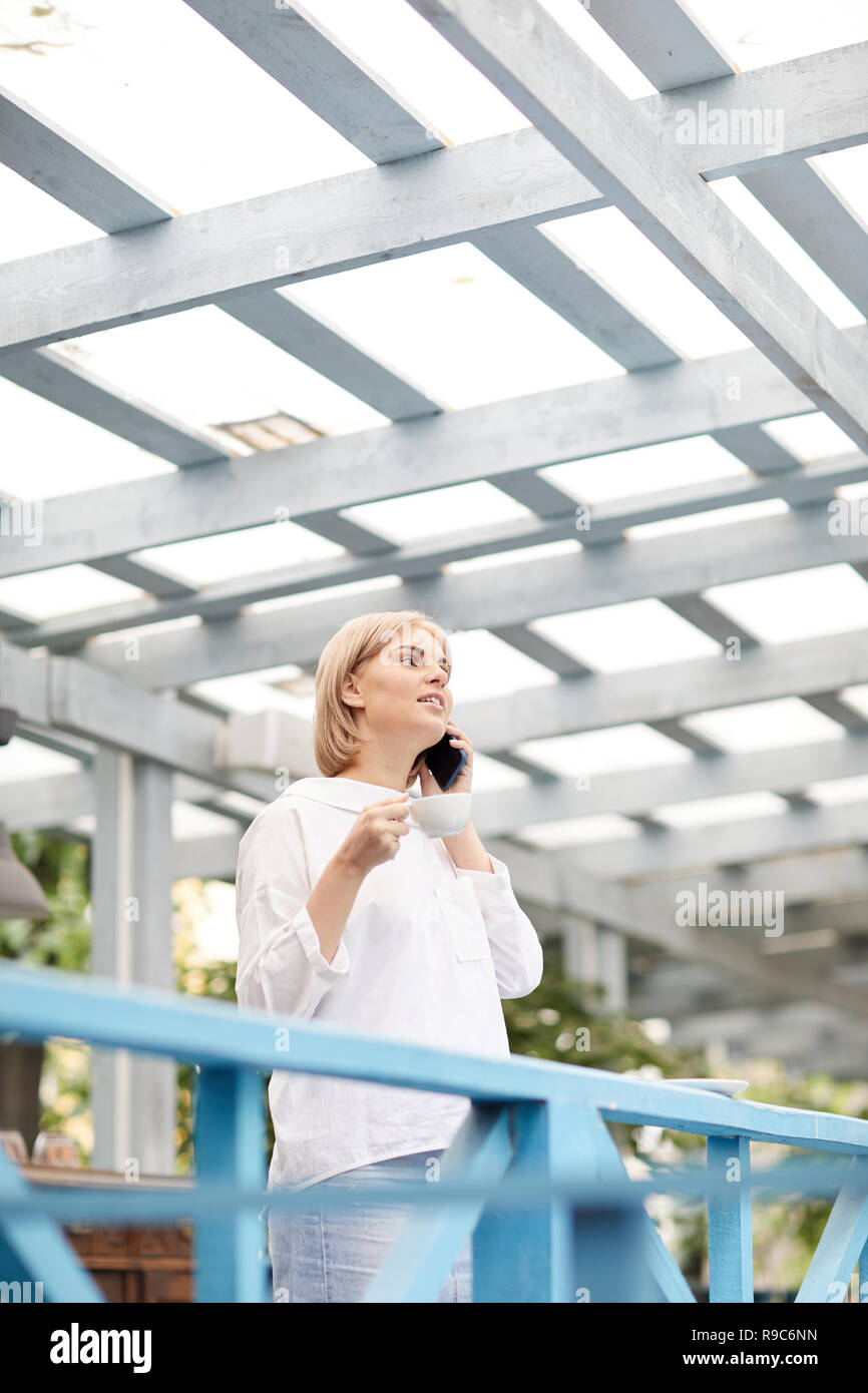 Having tea in outdoor cafe Stock Photo - Alamy