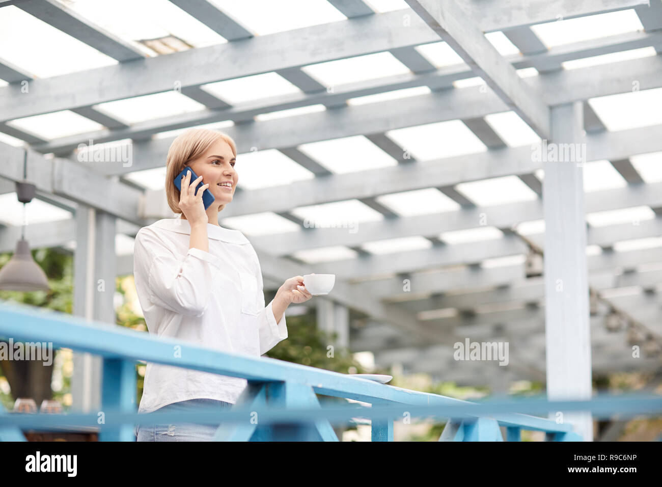 Coffee break in outdoor cafe Stock Photo - Alamy