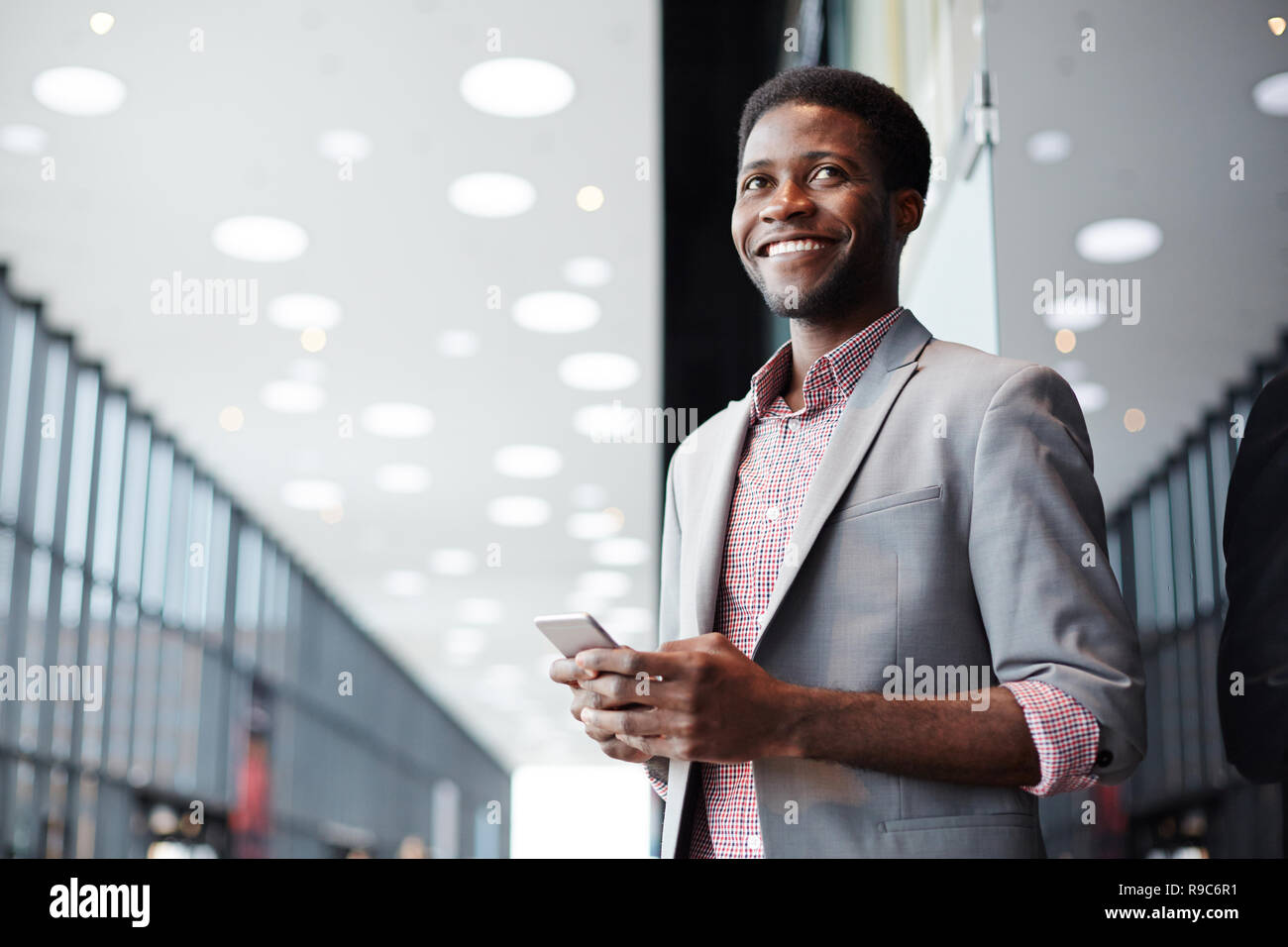 Businessman in lounge Stock Photo - Alamy