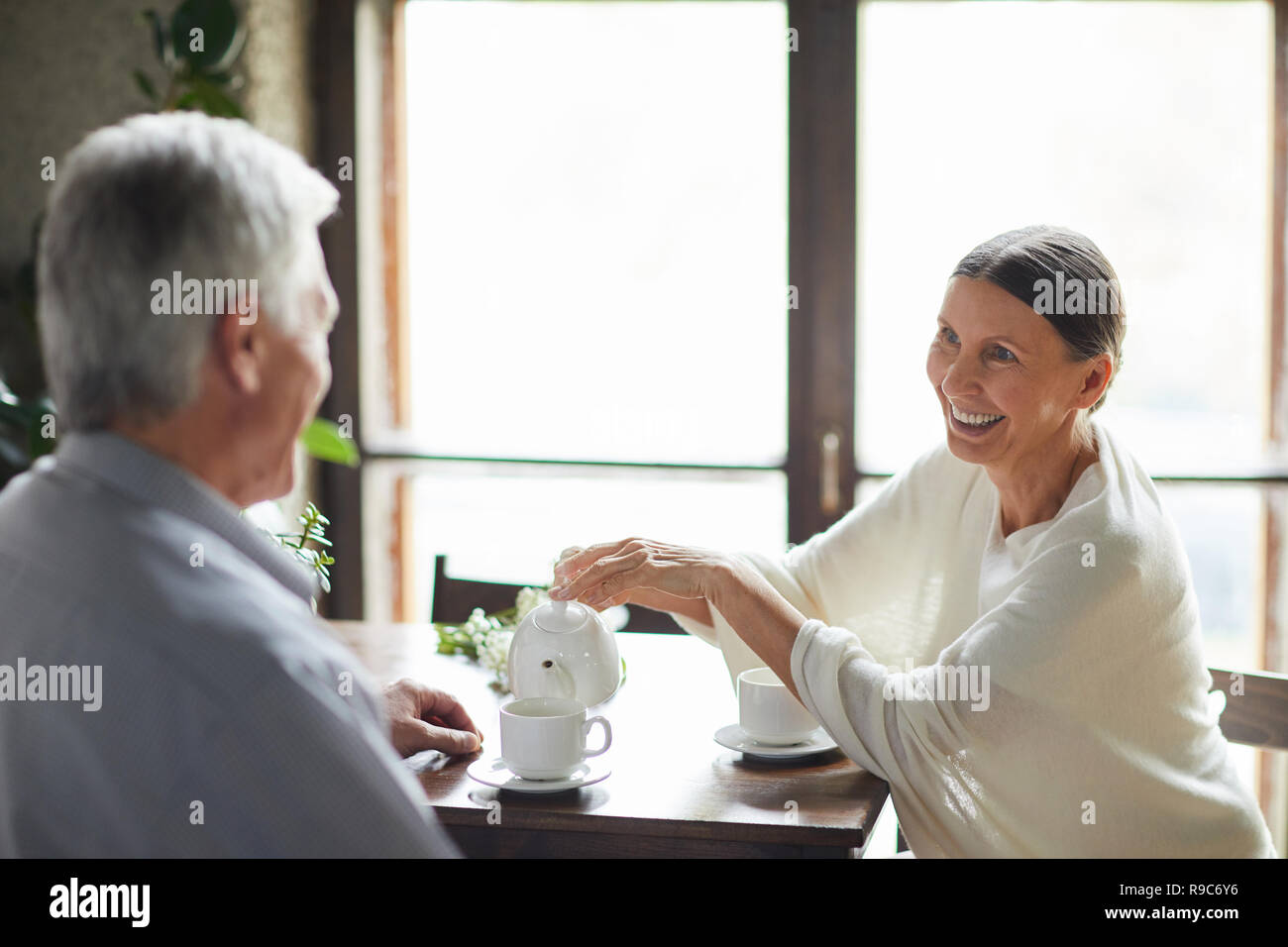 Having tea in cafe Stock Photo - Alamy