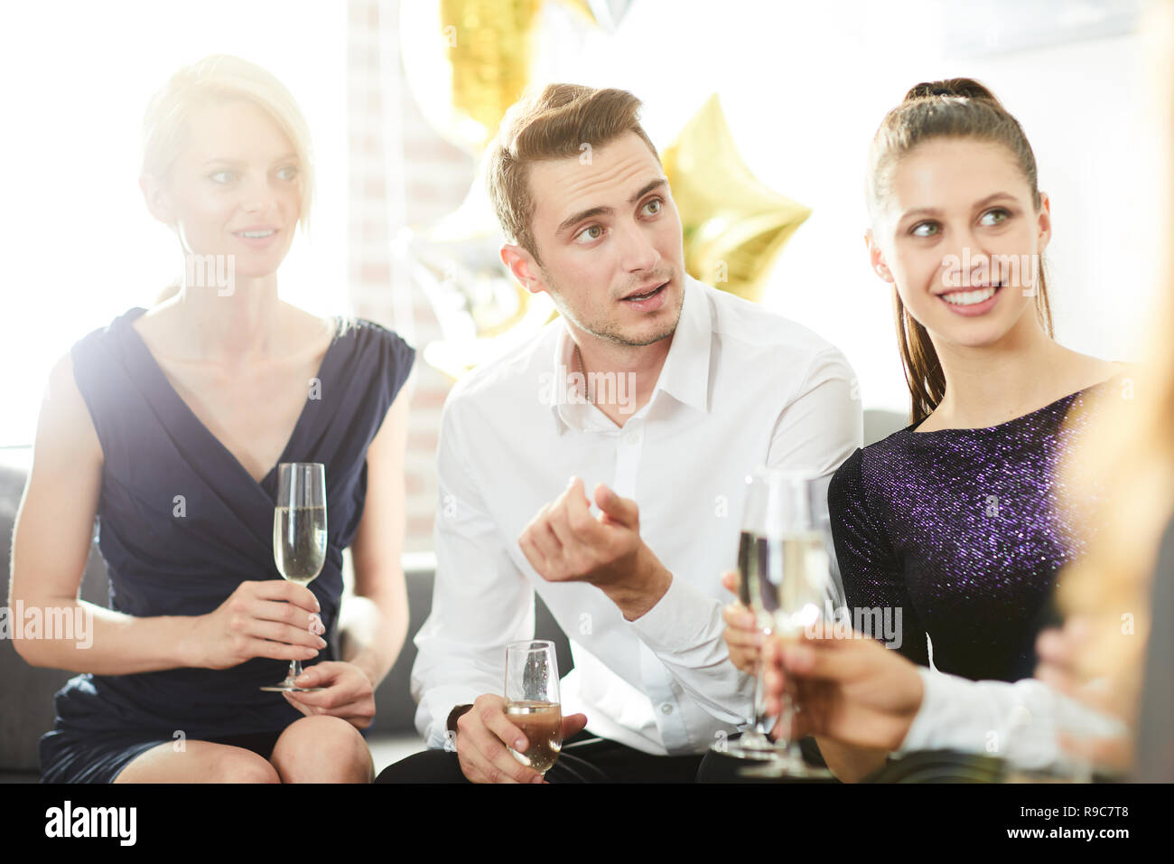 Friends talking at party Stock Photo - Alamy