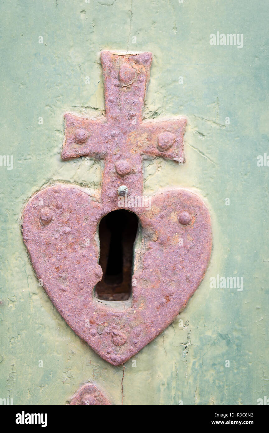 Vintage keyhole with a heart and cross in a old door Stock Photo - Alamy