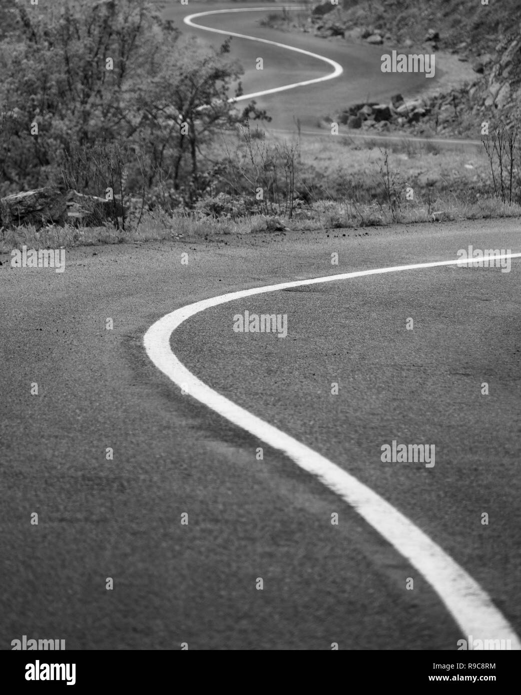 Asphalt winding country road Black and White Stock Photos & Images - Alamy