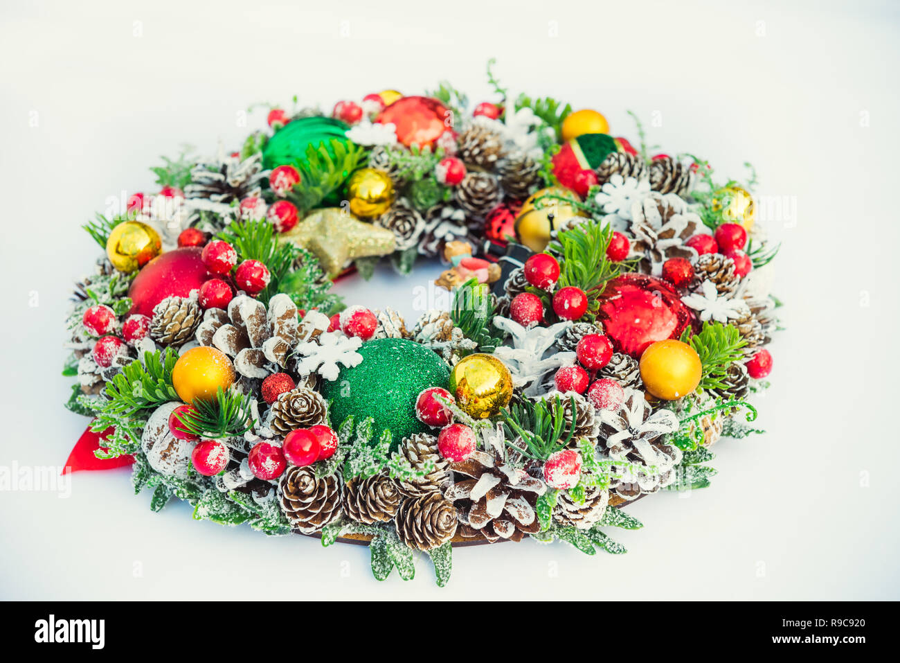 Beautiful traditional bright Christmas wreath decorated with pine cones ...