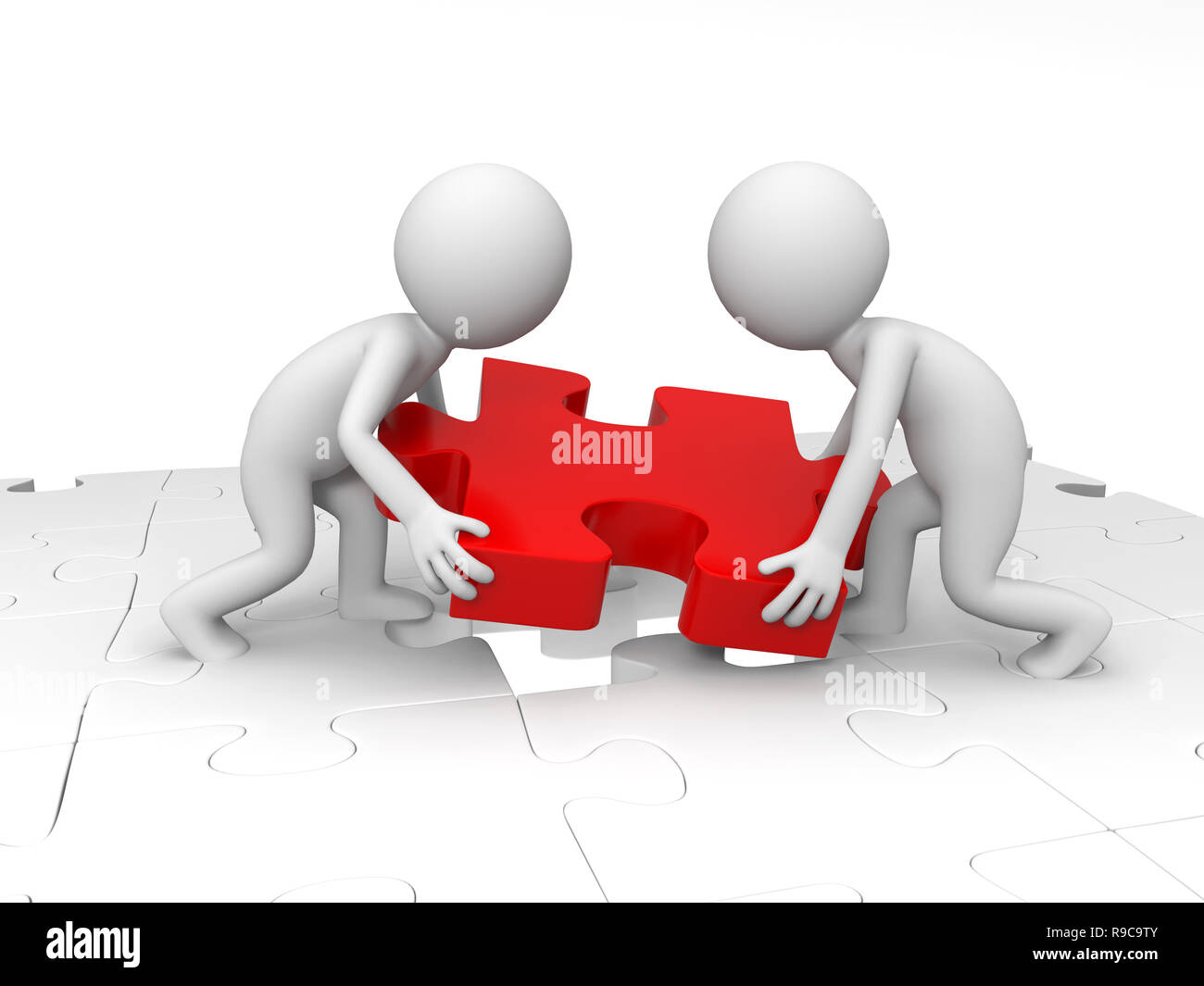 Two people are moving the puzzles Stock Photo - Alamy