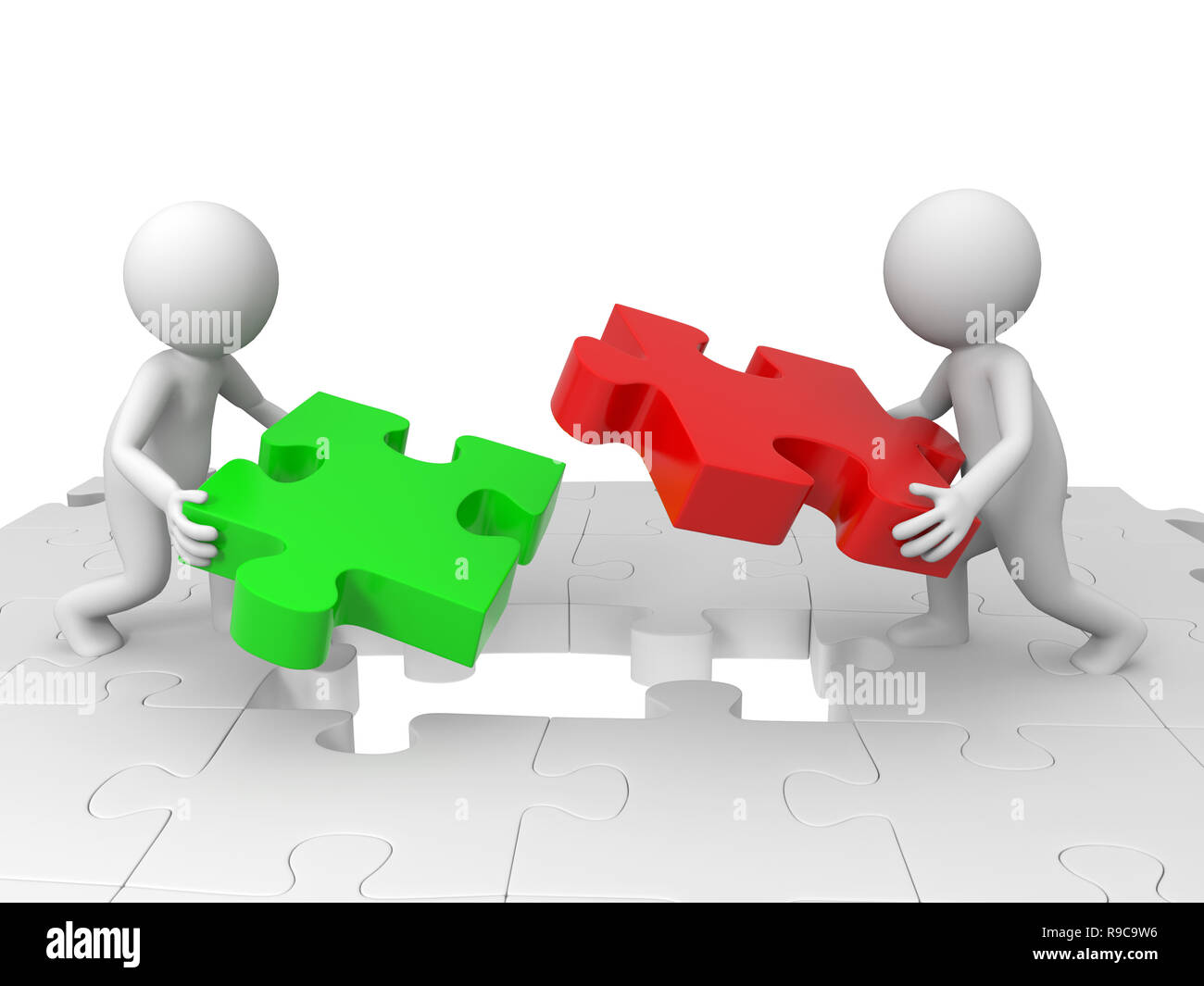 Two people are moving the puzzles Stock Photo - Alamy