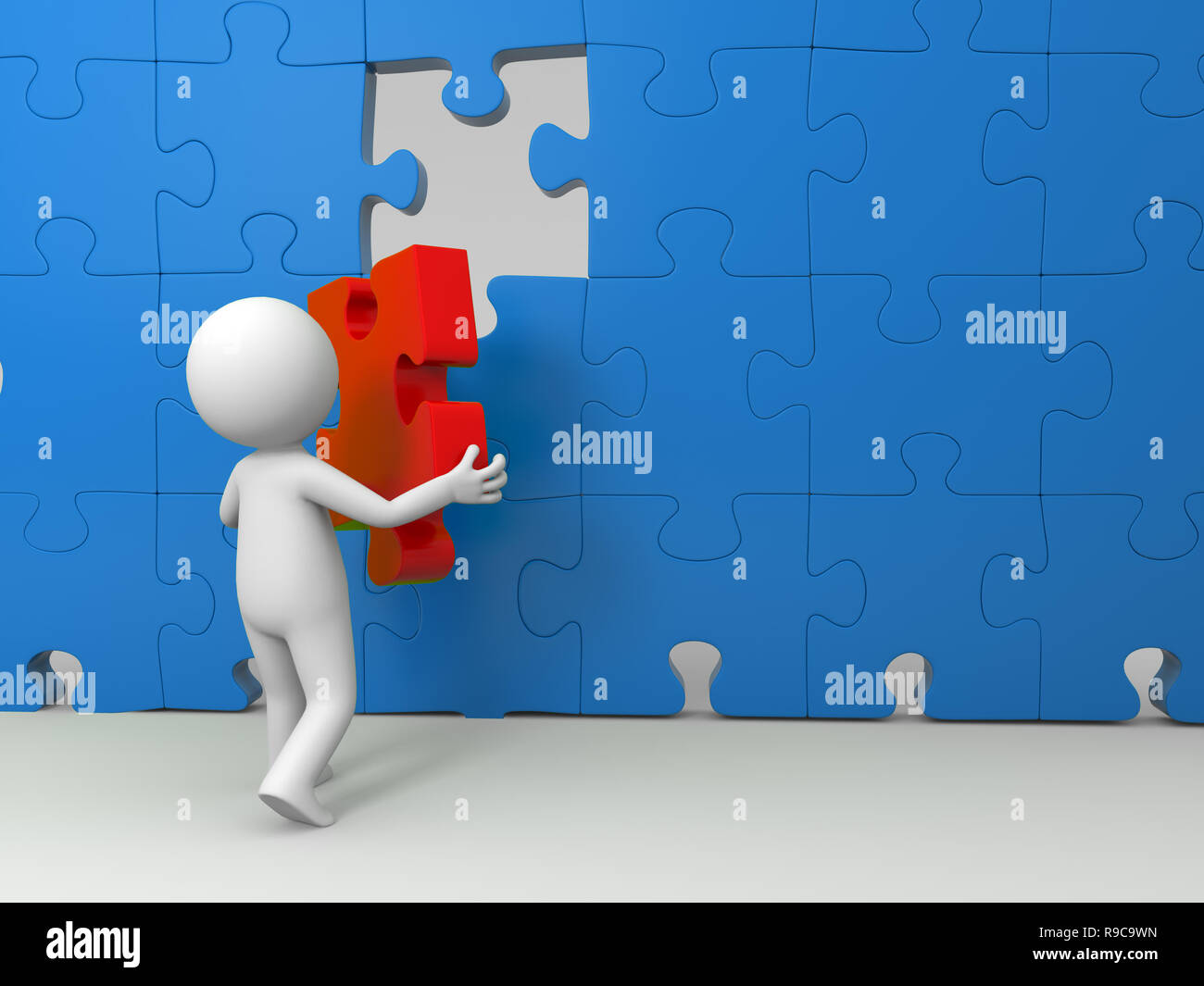 A people is moving the puzzles Stock Photo - Alamy