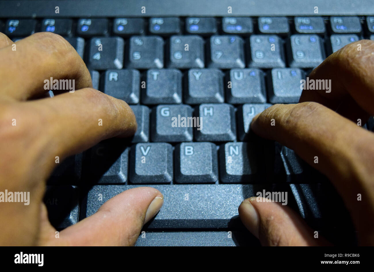 Hand male press keyboard computer on selective focus background Stock ...