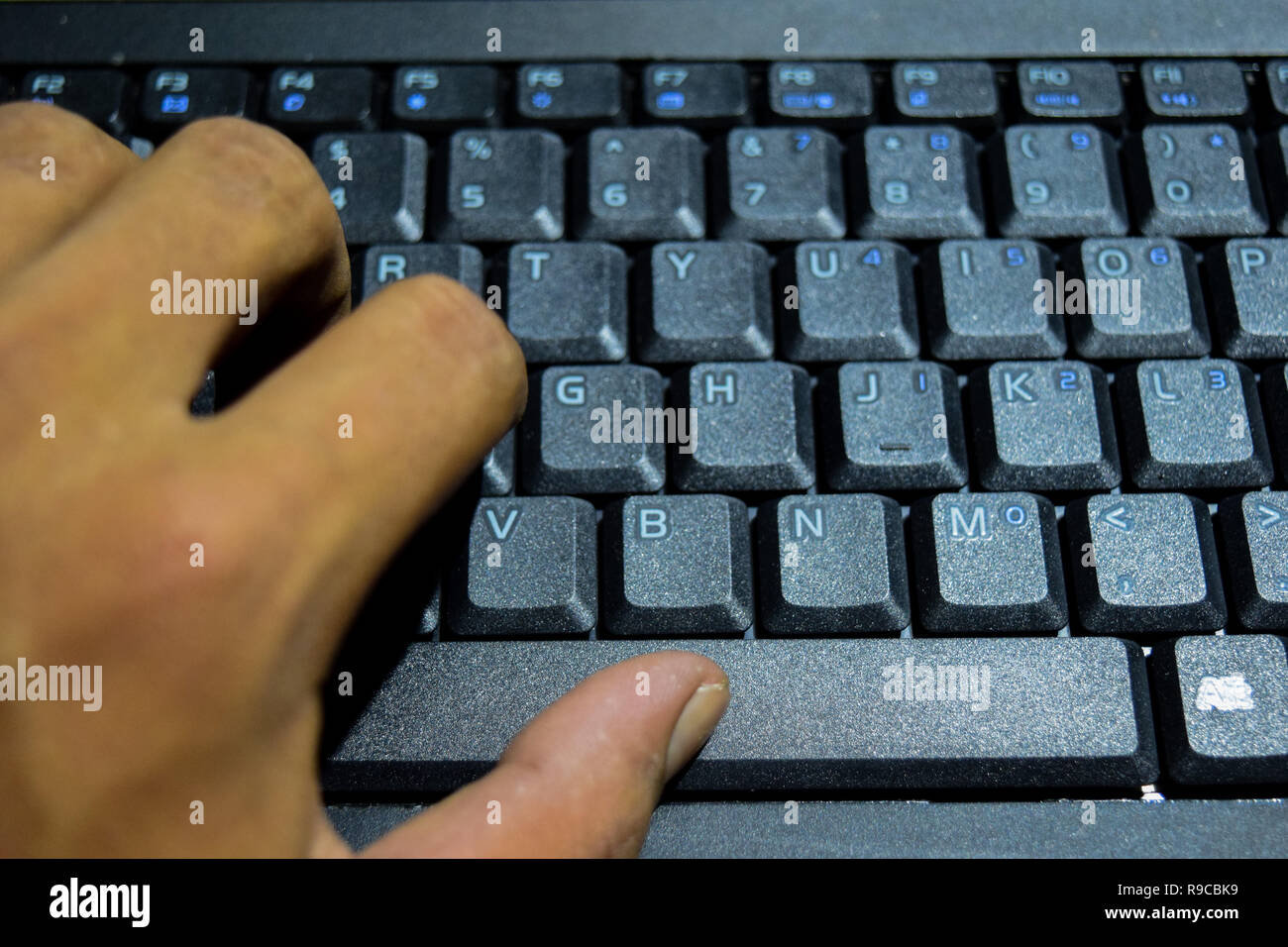 Hand male press keyboard computer on selective focus background Stock ...