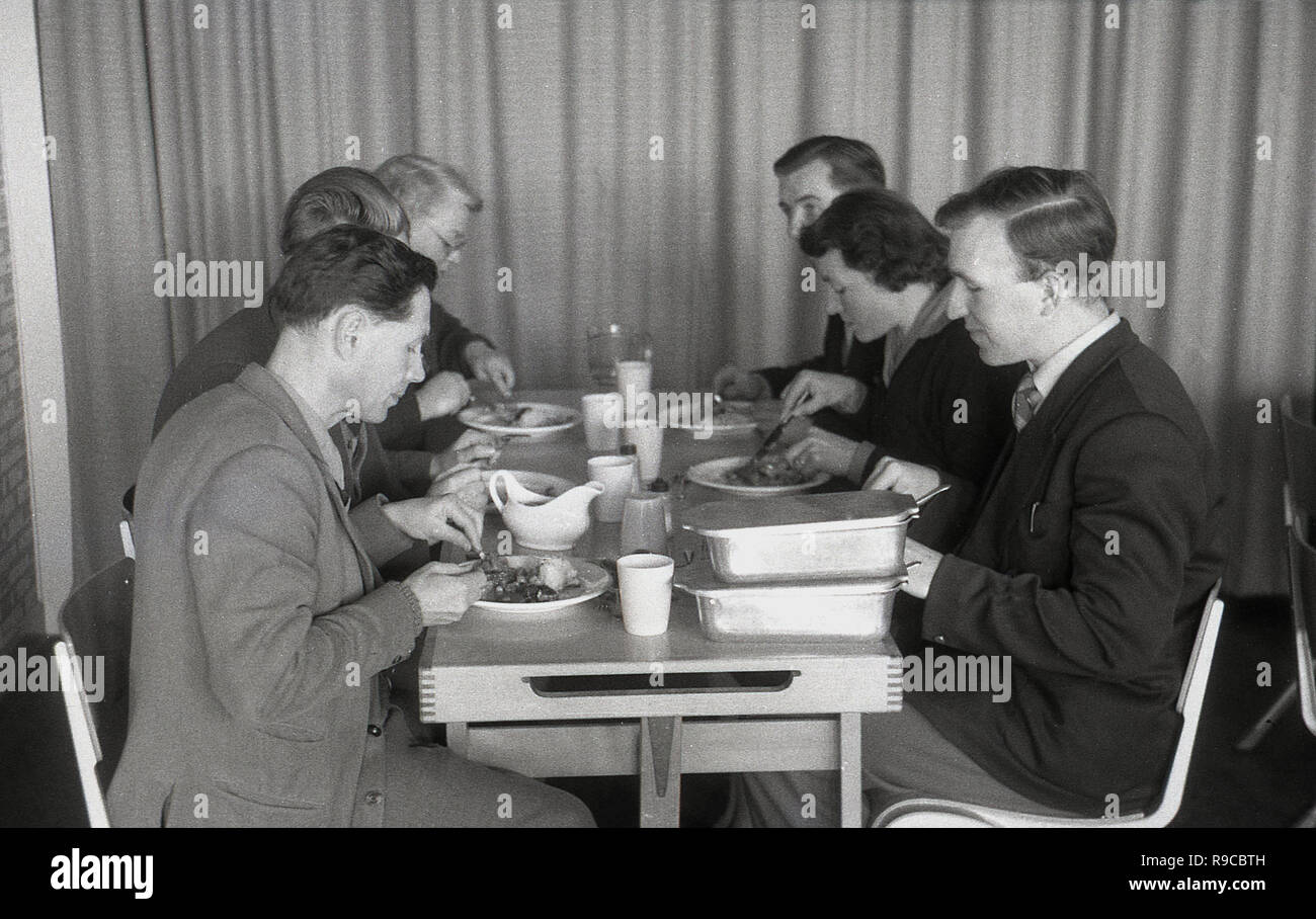 1950s, historical, group of school teachers sitting at a table having ...