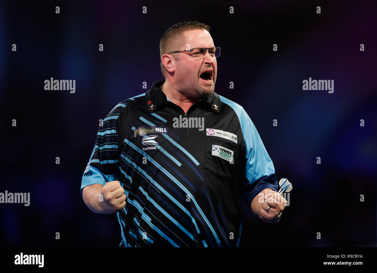 Alan Norris celebrates winning a set during his match against Ryan ...