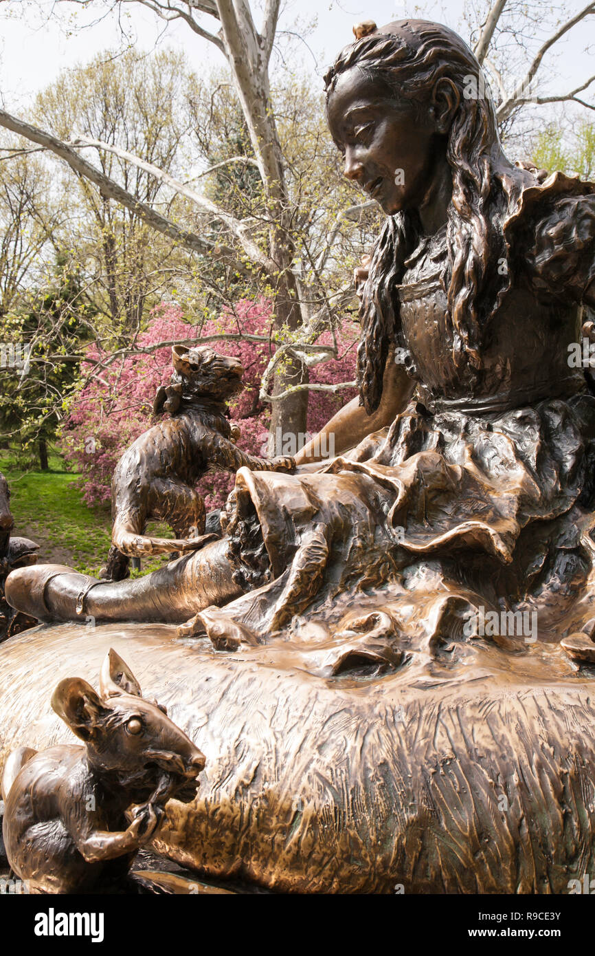 Alice in Wonderland Sculpture is framed by spring trees, Central Park ...