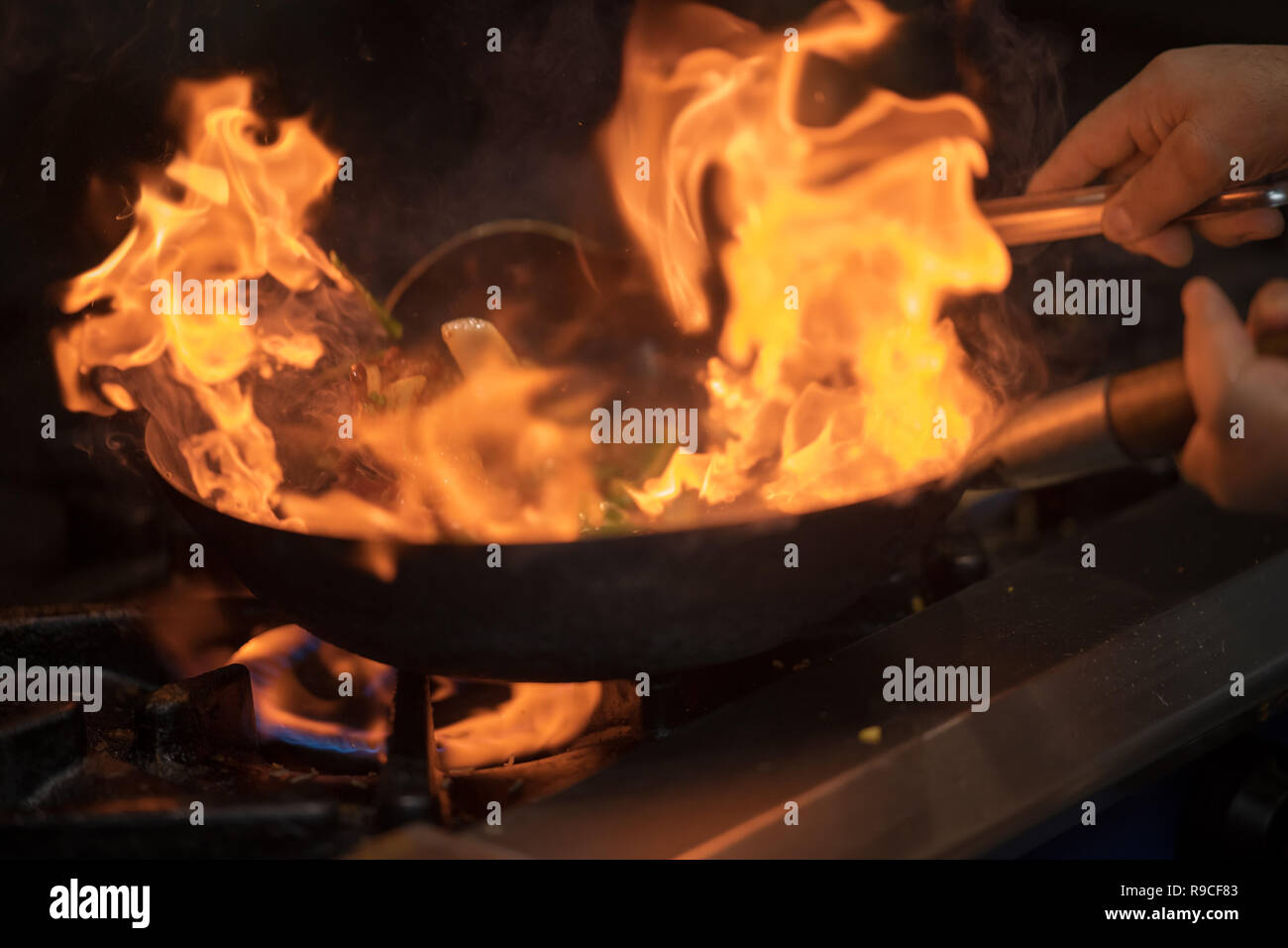 wok, frying pan with flames Stock Photo - Alamy