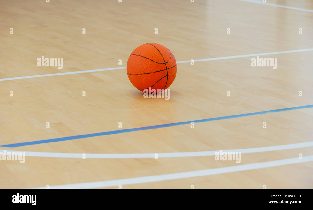 Basketball ball over floor in the gym. Team sport Stock Photo - Alamy