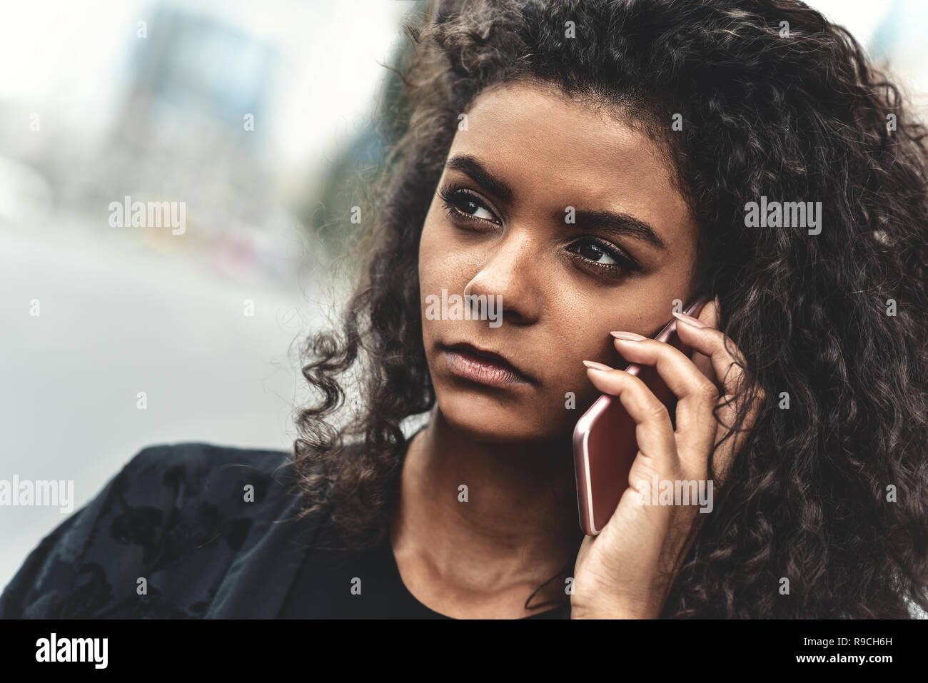 Sad woman walking and writing or reading sms messages Stock Photo - Alamy