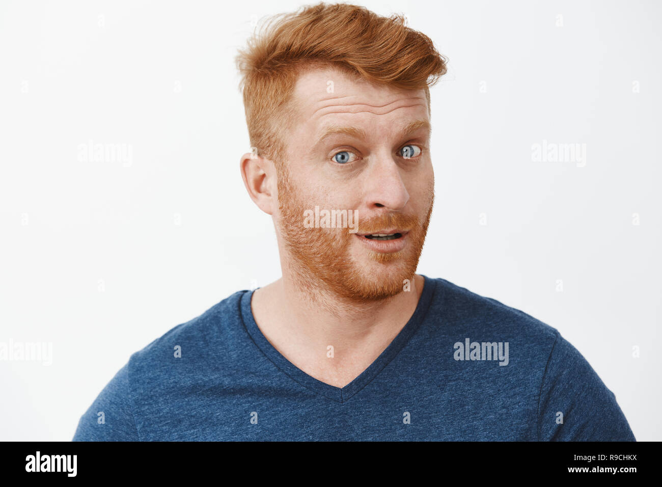 Headshot Of Intrigued Good Looking Ginger Male With Bristle In Blue T