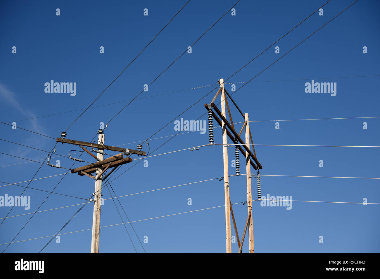 Electrical utility poles and high voltage power lines, electrical grid ...