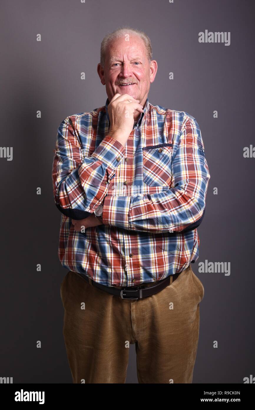Beautiful old man in front of a background Stock Photo - Alamy