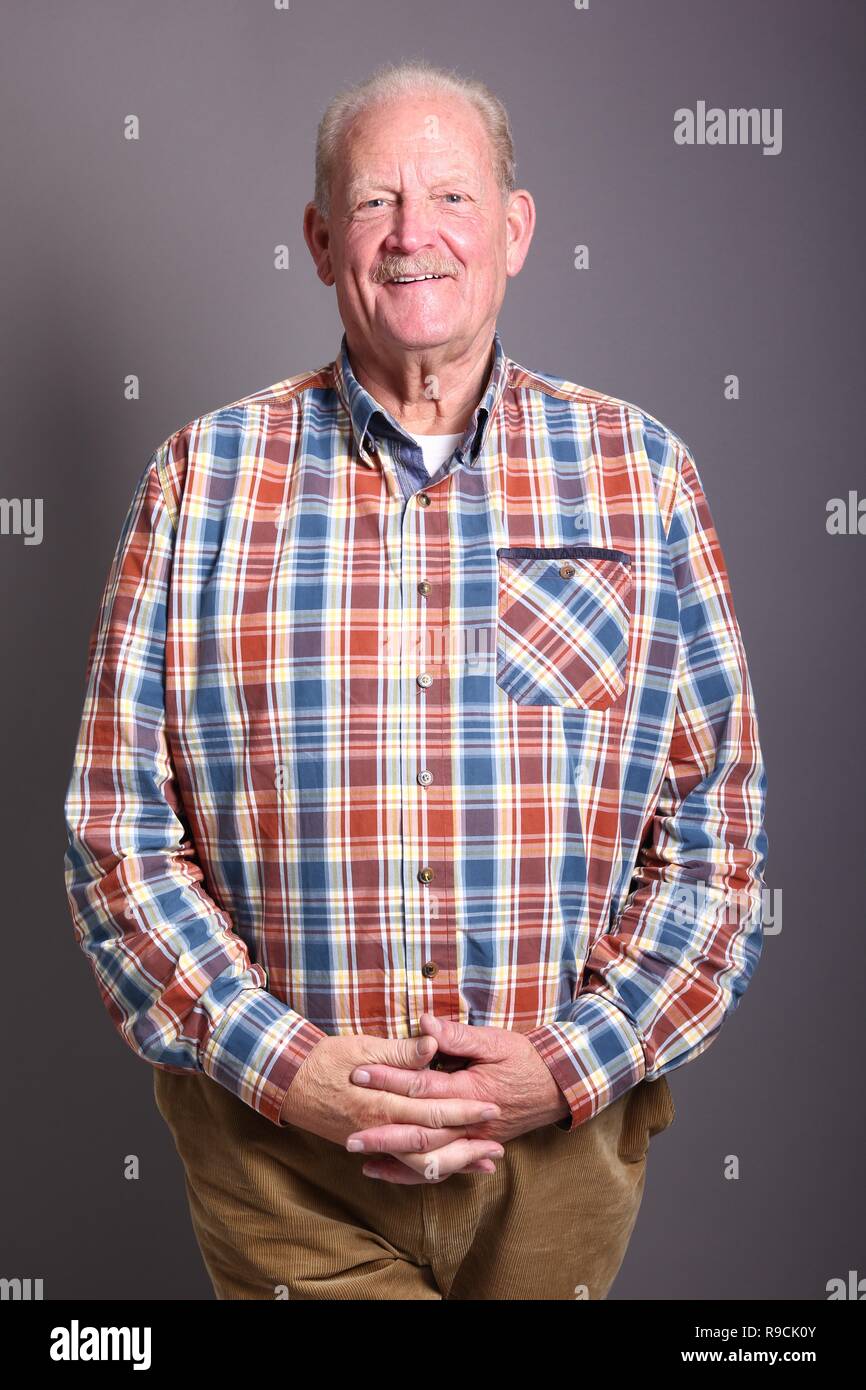 Beautiful old man in front of a background Stock Photo - Alamy